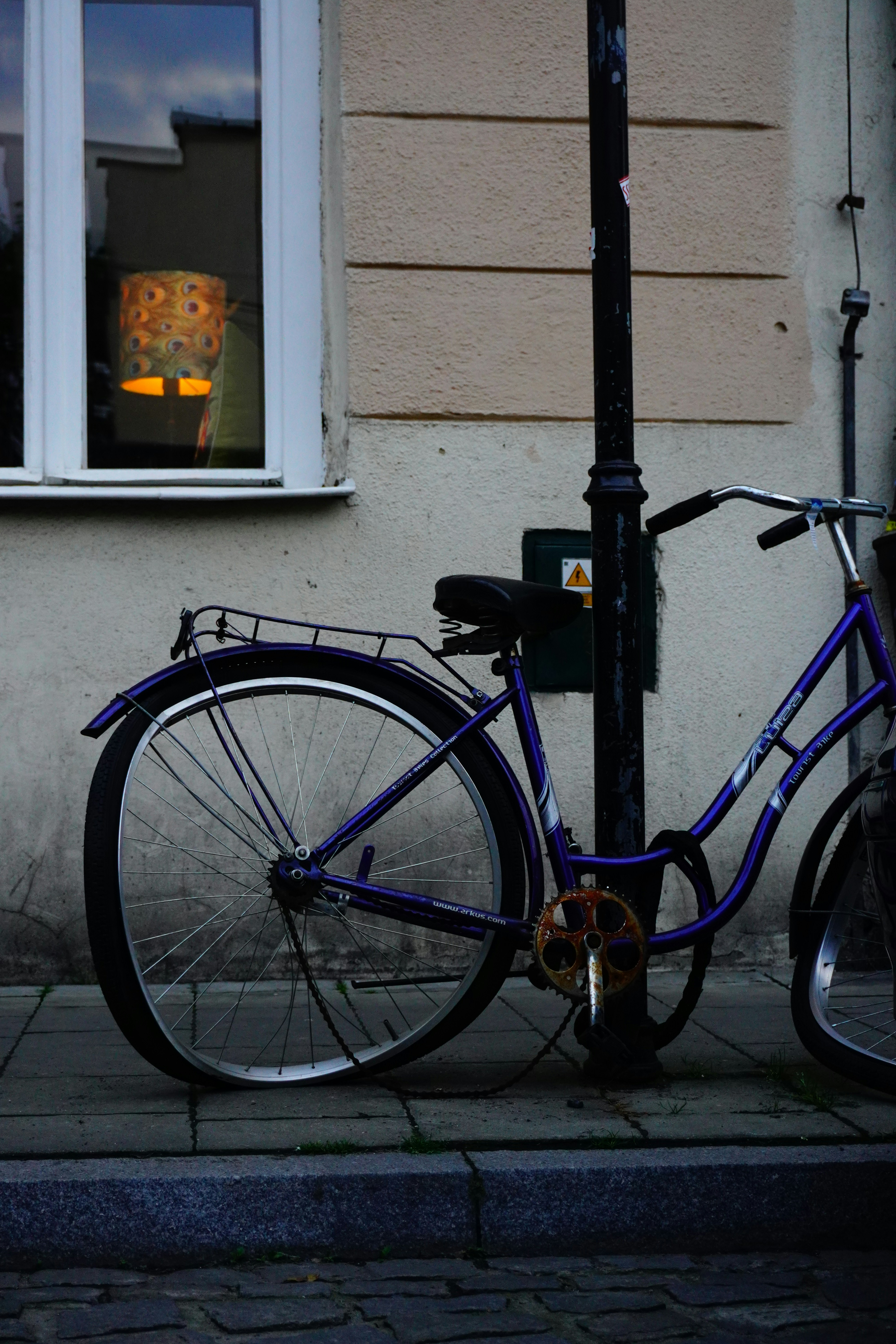 Blue Bicycle by the Wall: Quiet Urban Quietude