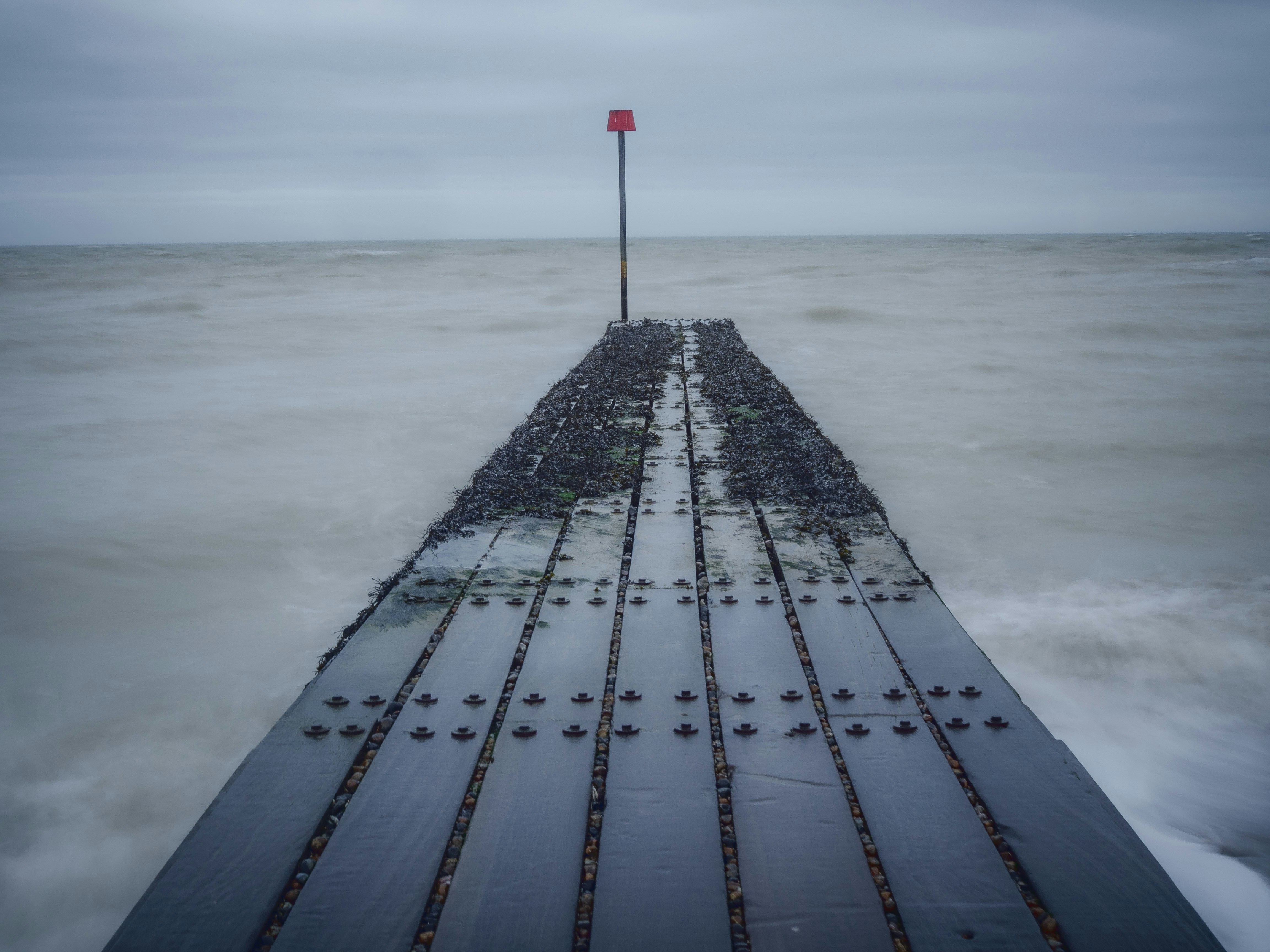 Emerging Pier: A Lonely Path to the Sea