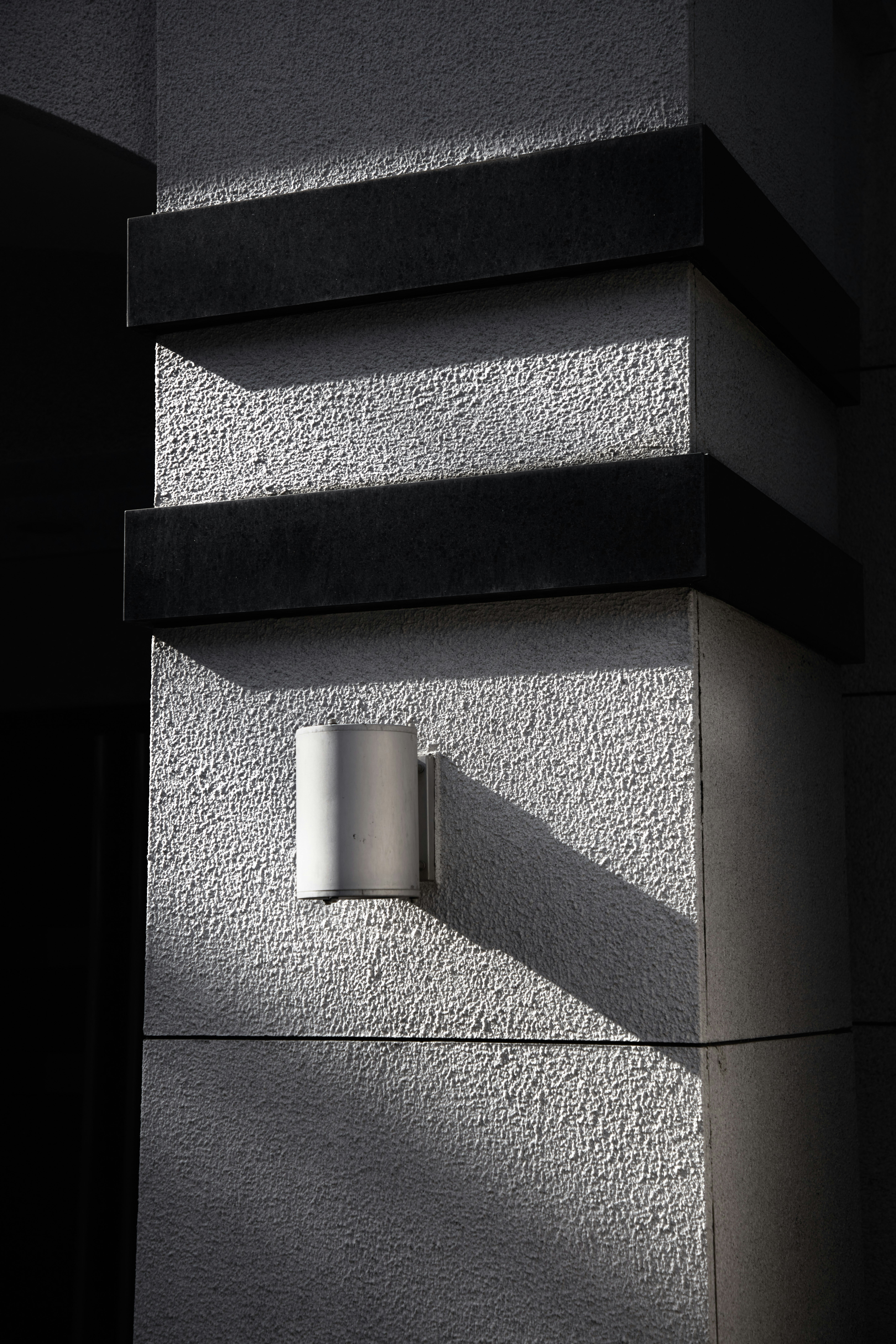 Shadowed Pillar Lamp Casting Angled Geometry