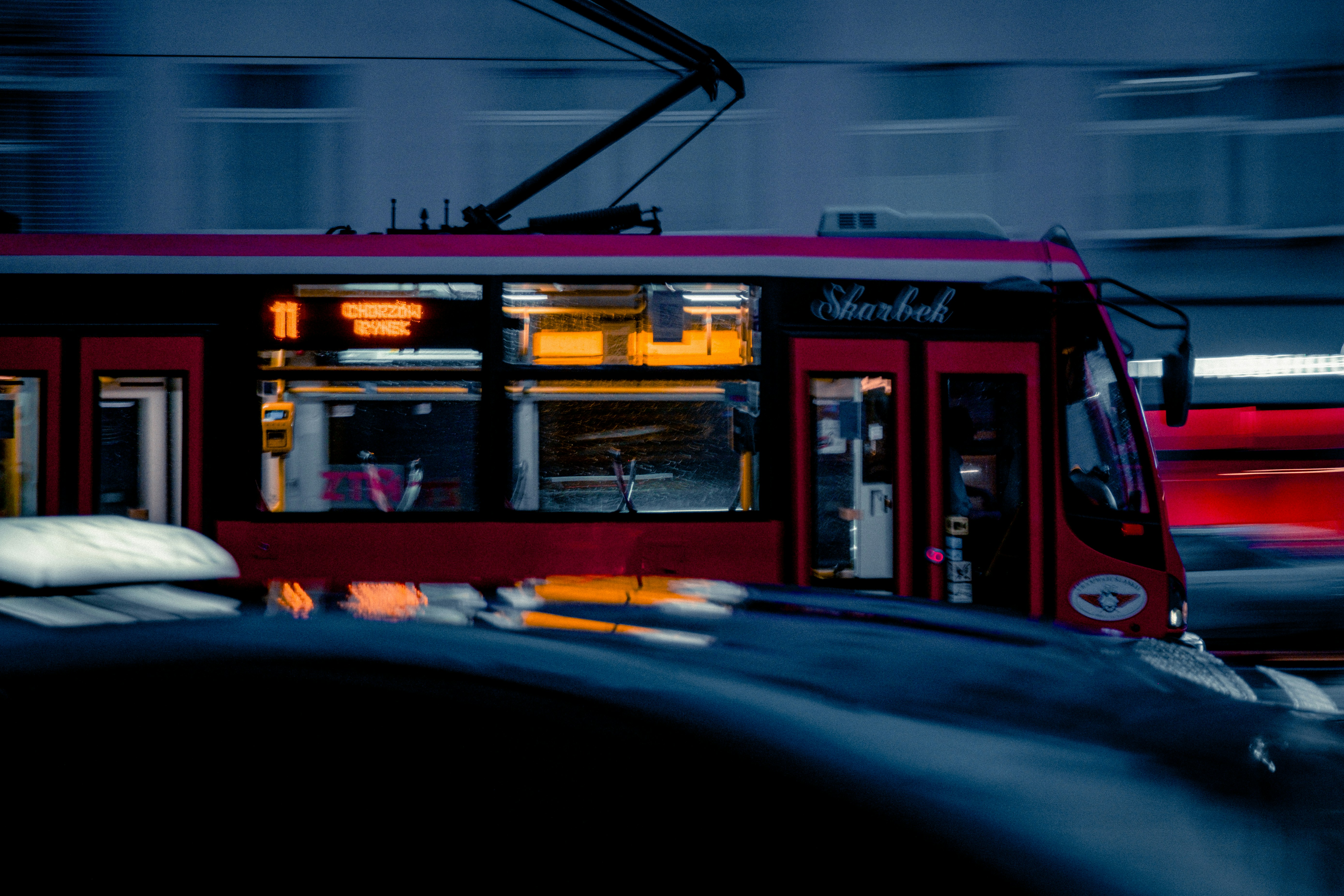 Streaking City Red: A Moving Tram in Evening Light