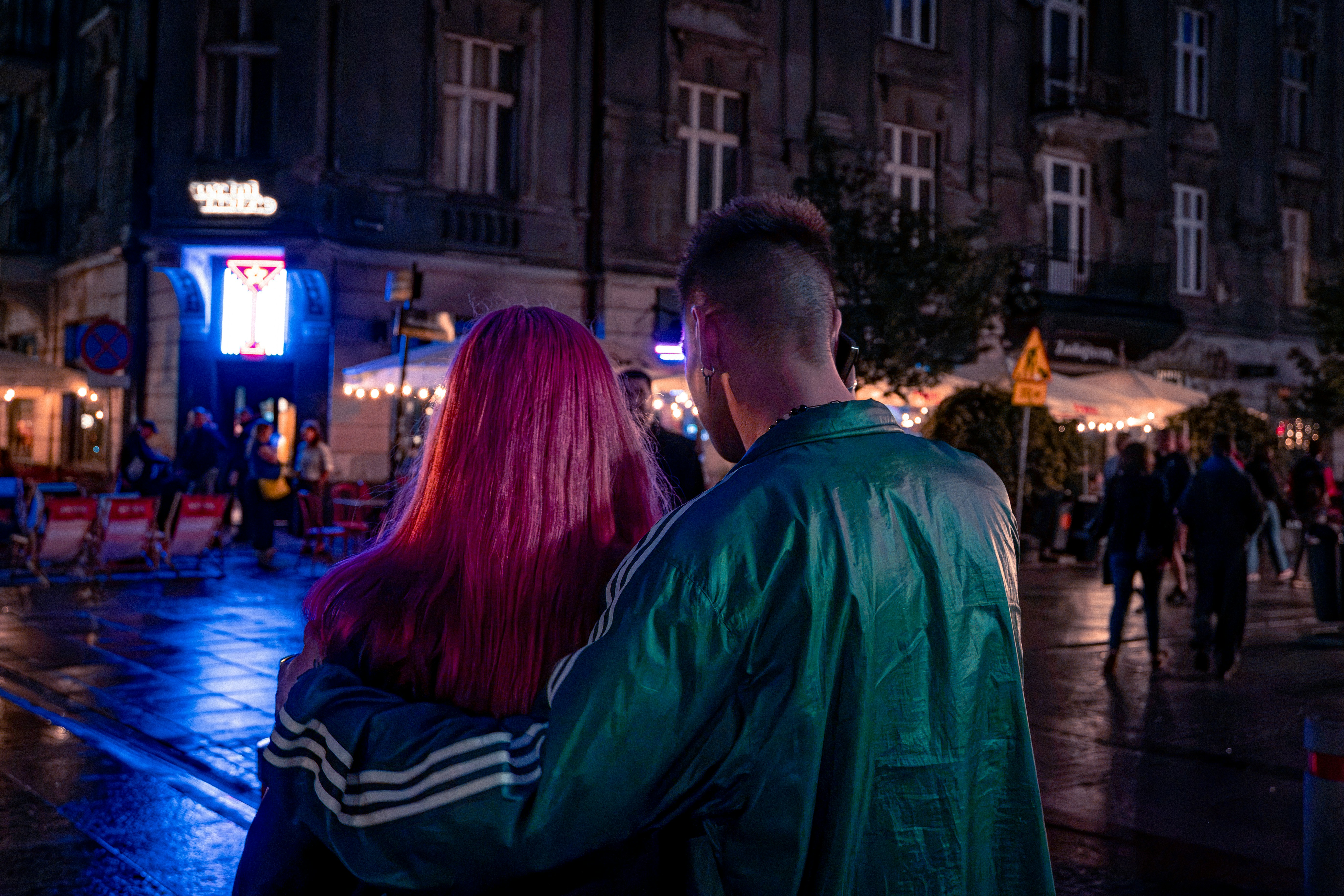 Neon Night: A Couple in the Bright Street Pulse