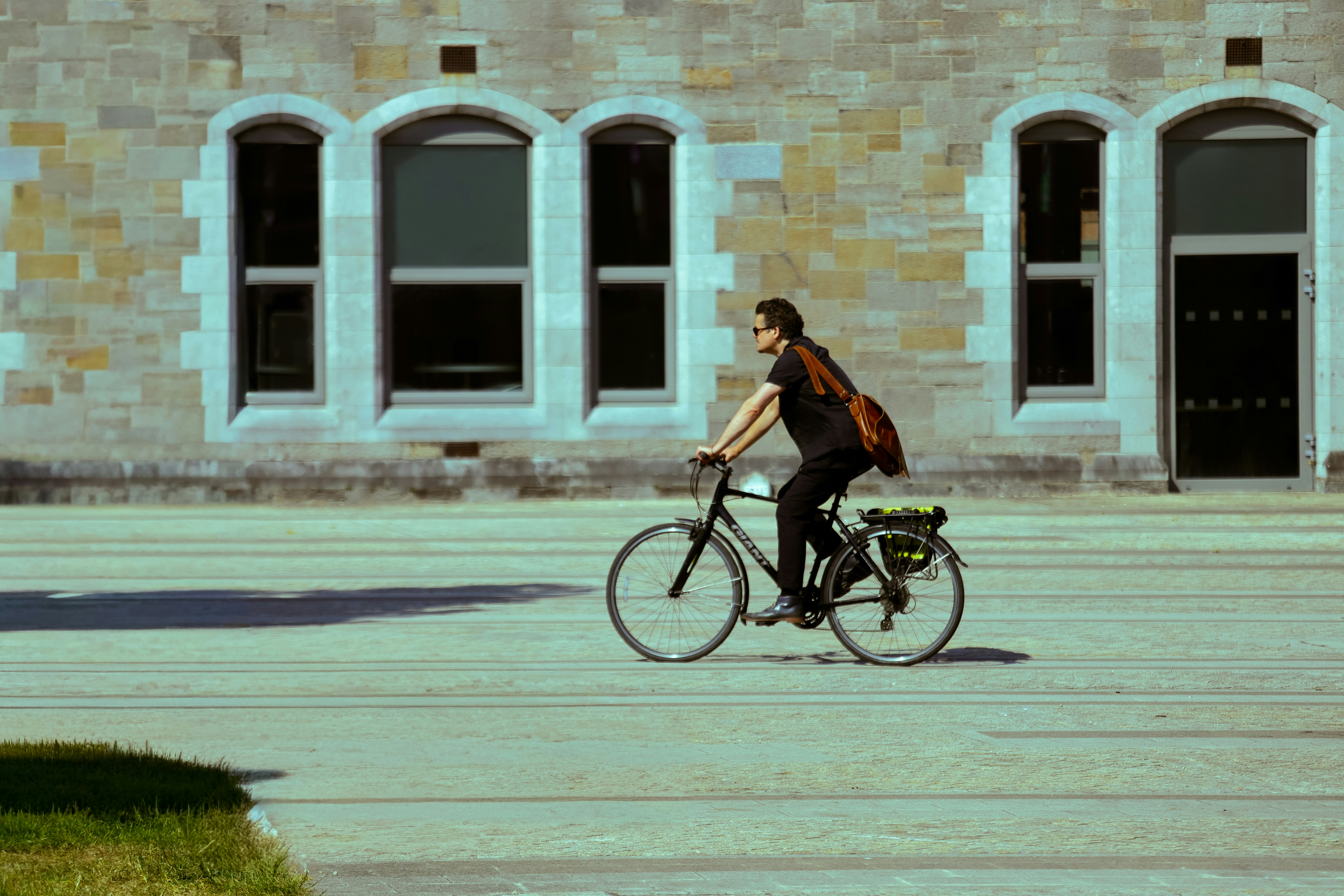 Pedaling Through a Quiet Campus Courtyard