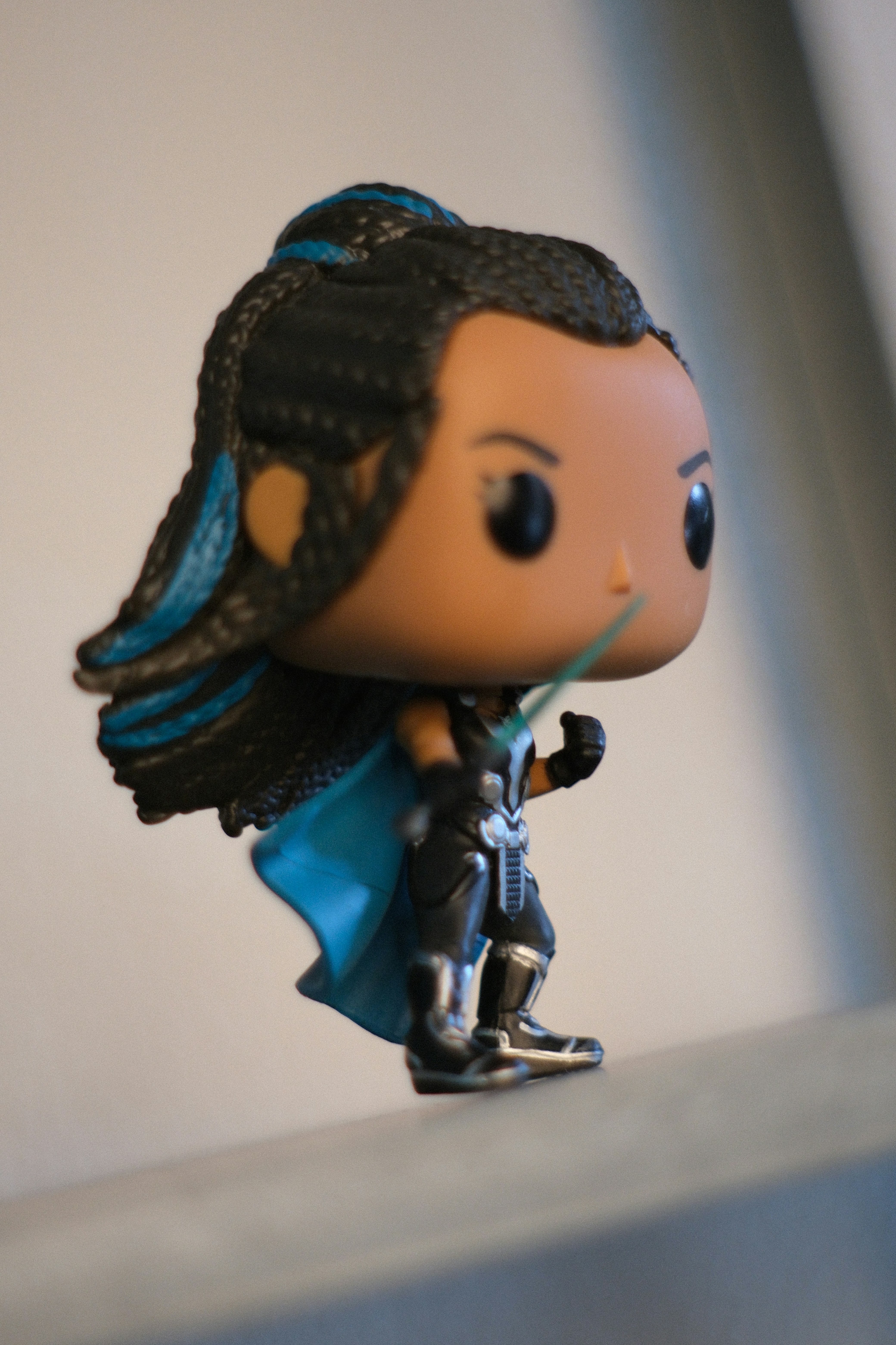 Funko pop valkyrie figure holding a blue sword.