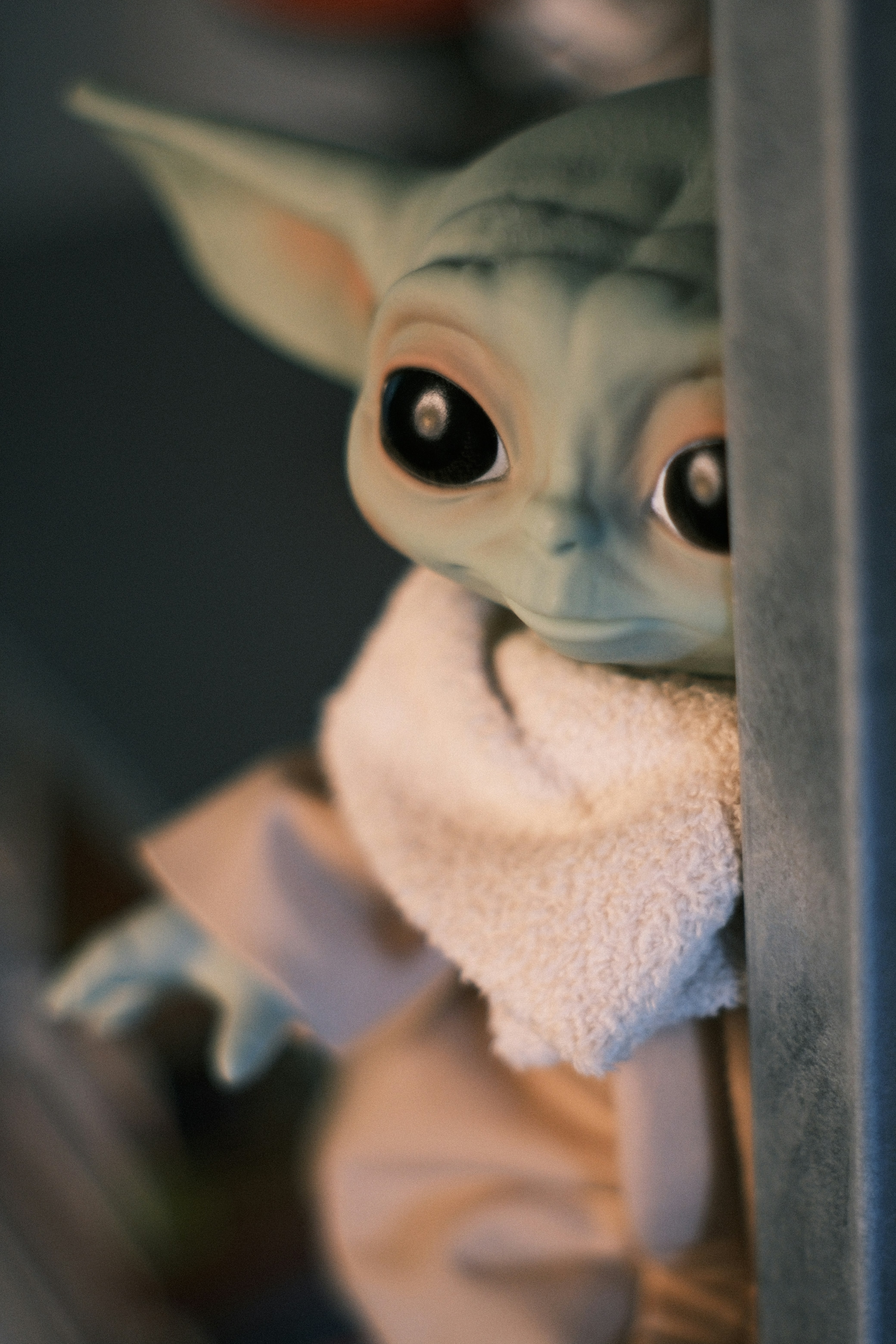 Curious Grogu Peeking from the Edge
