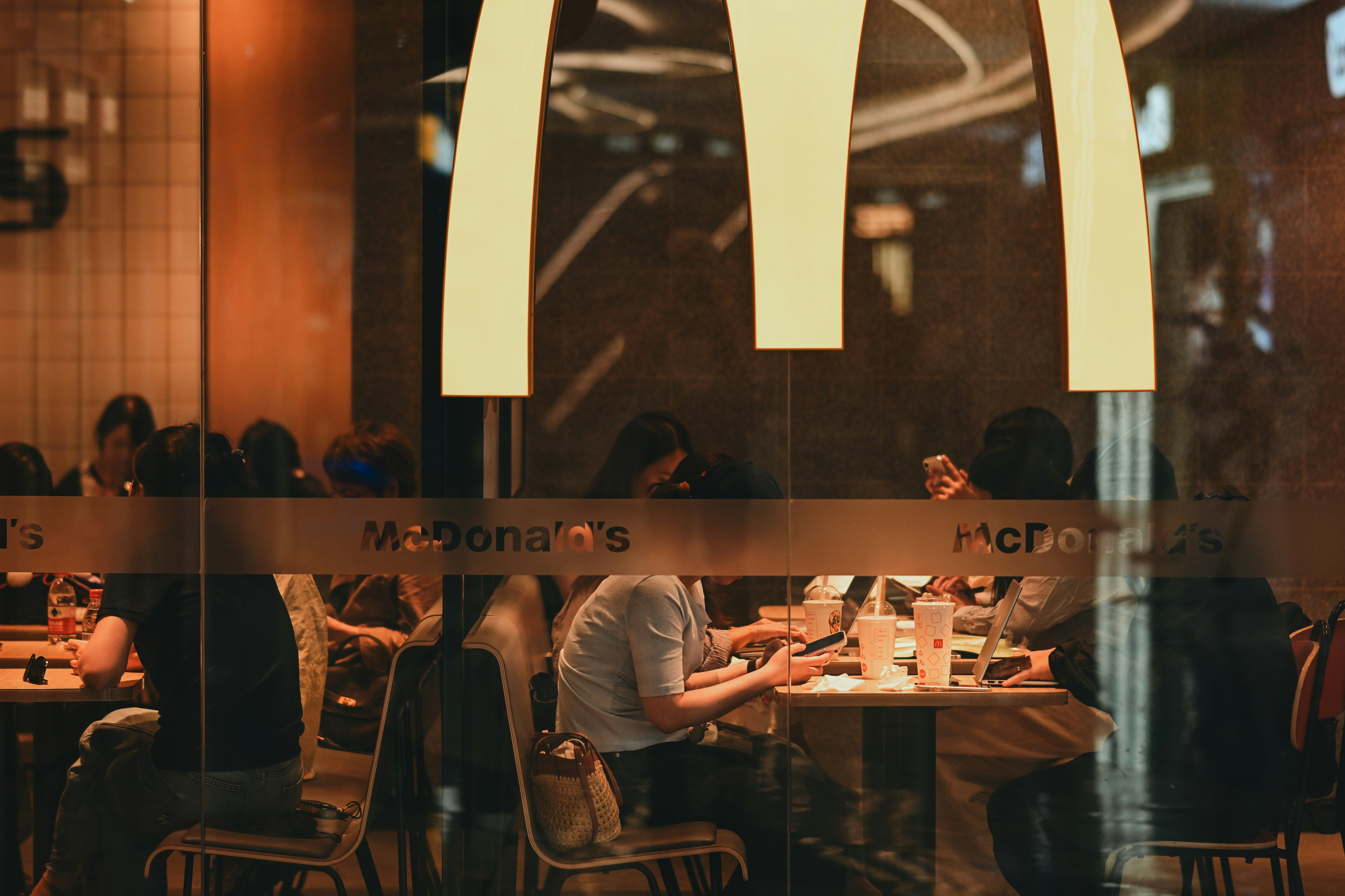 Midday Quiet at the Golden Arches: Reflections Through Glass