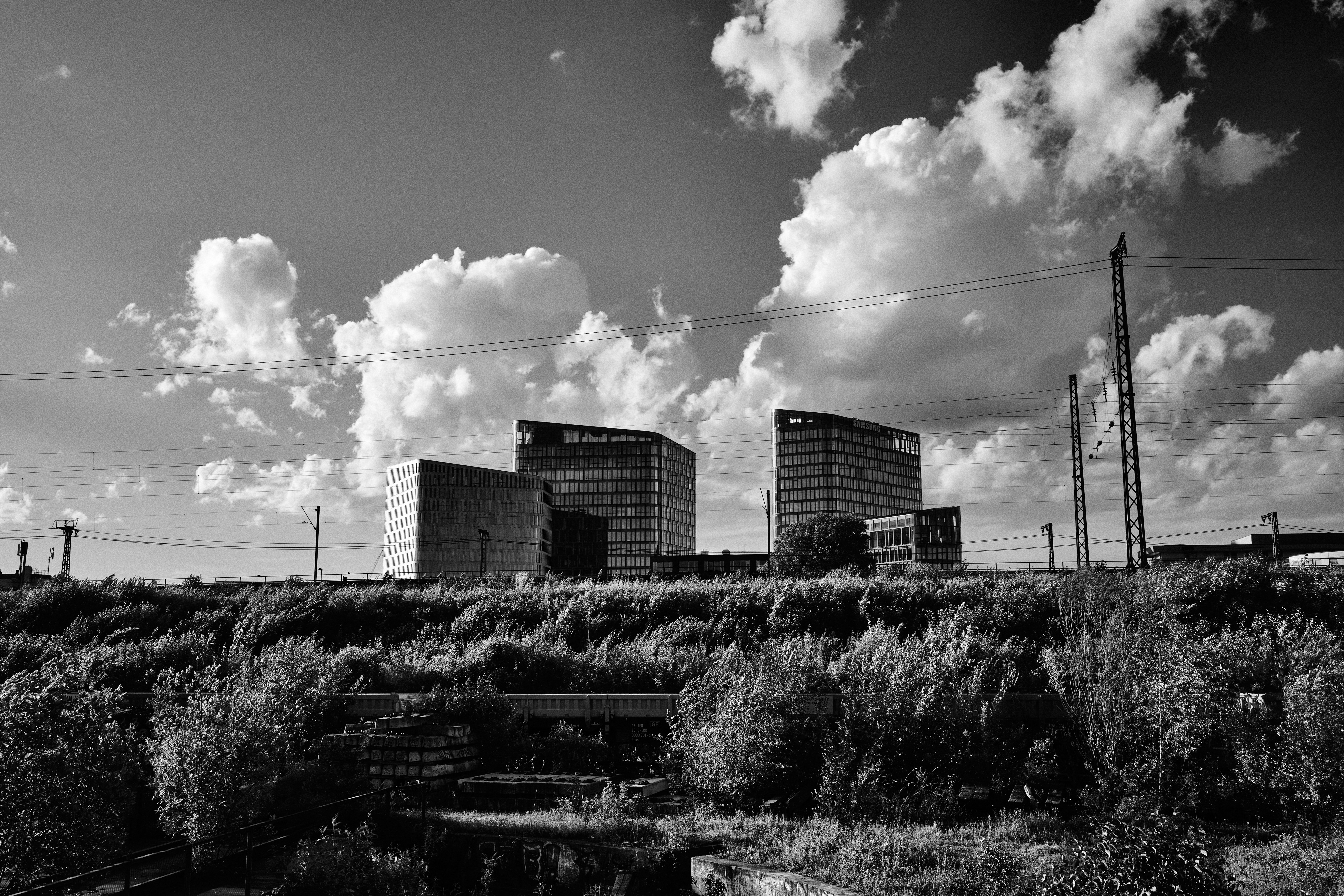 Industrial silhouettes under a sweeping cloudscape