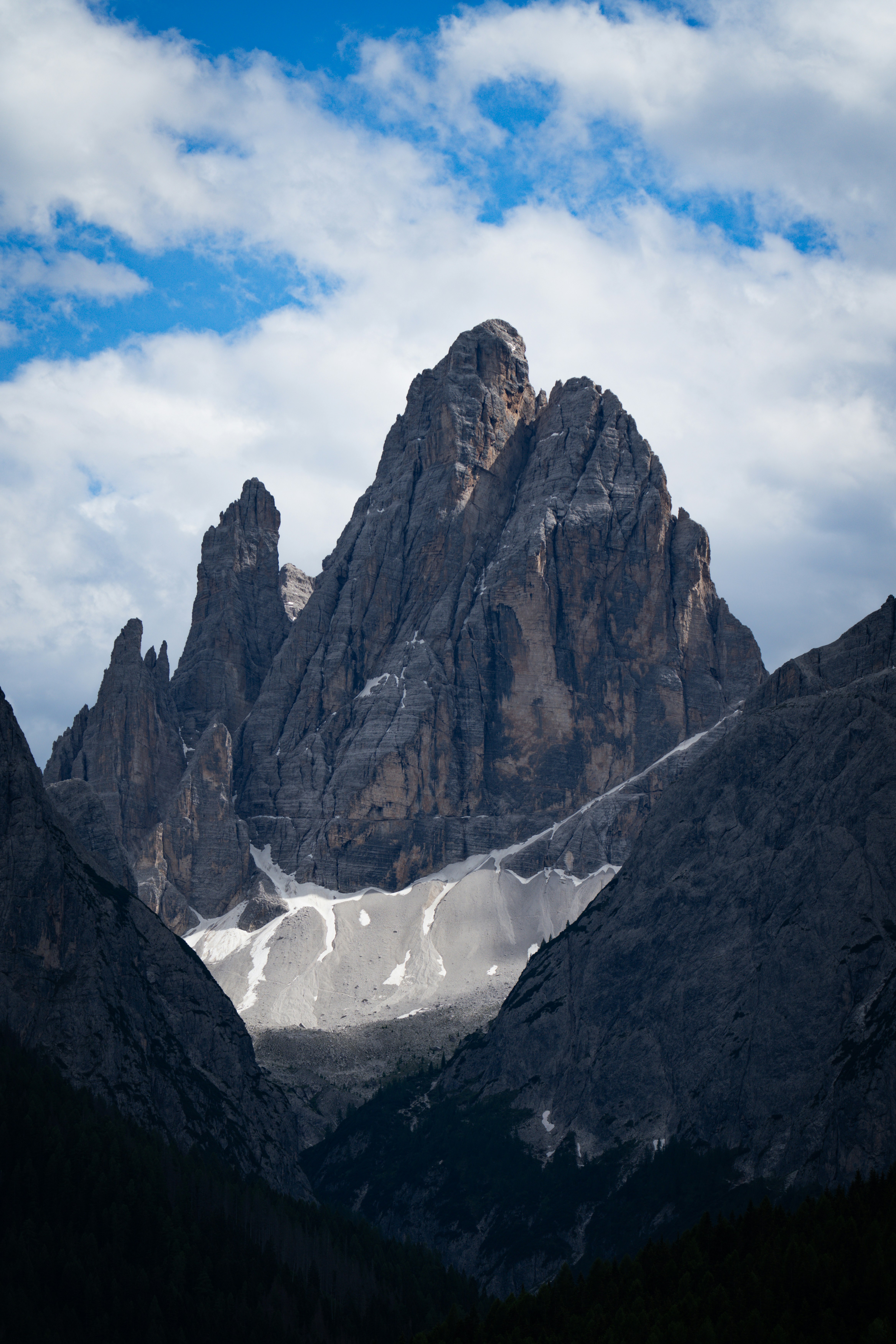 Rugged Peak Piercing a Sky of Clouds