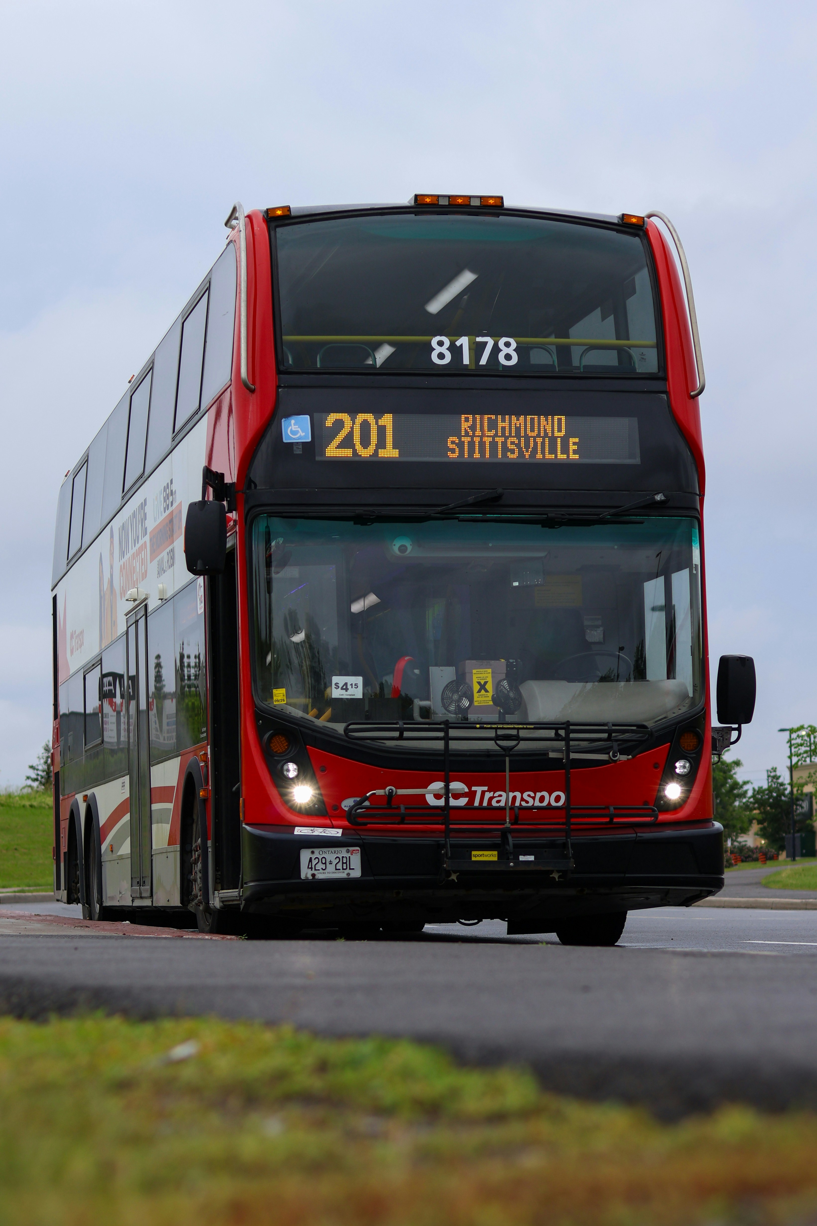 Front-On City Link: A Red Double-Decker Heads Toward the Horizon