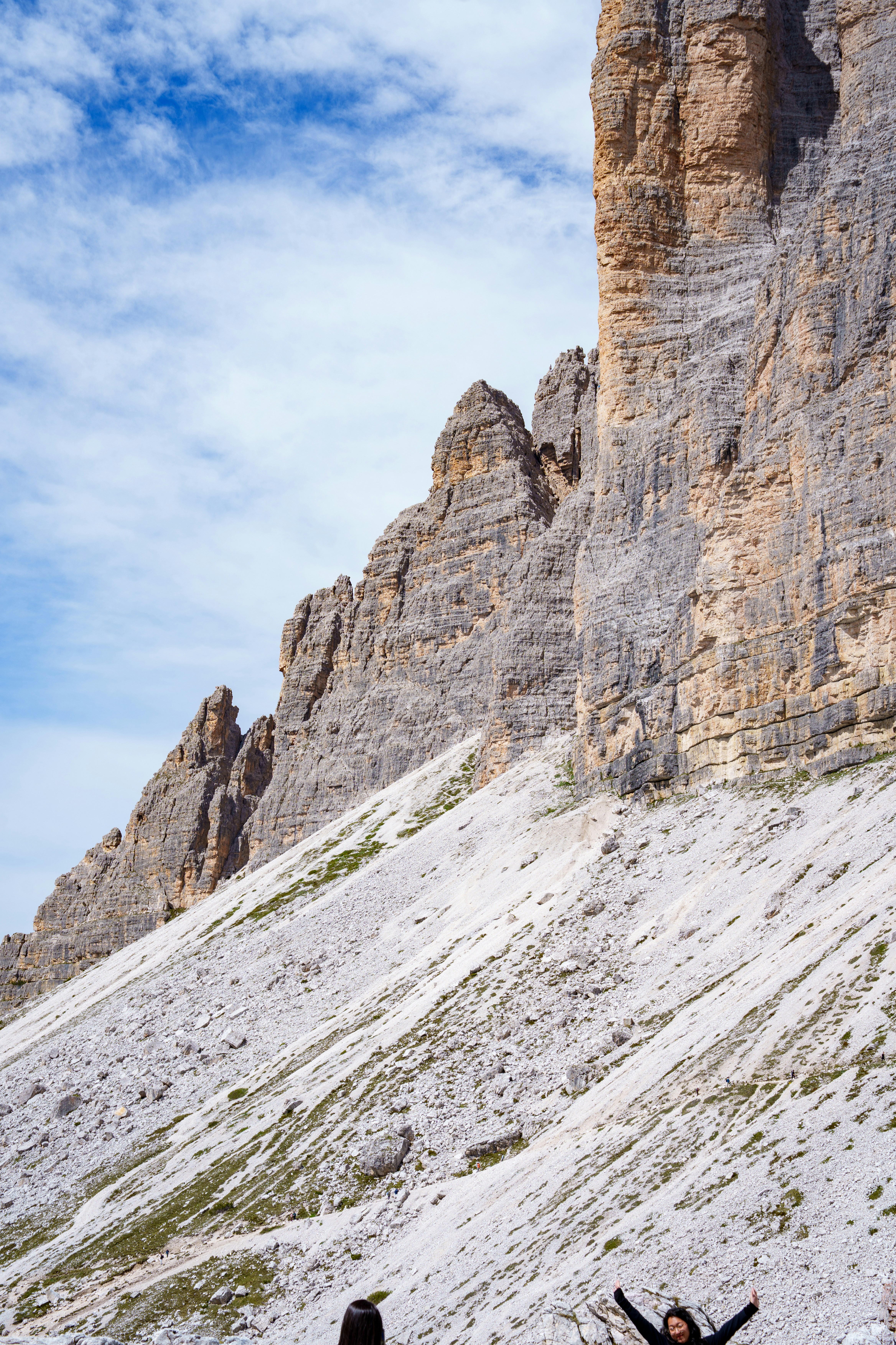 Ridge Summit: Climbers at the Base of a Majestic Alpine Cliff