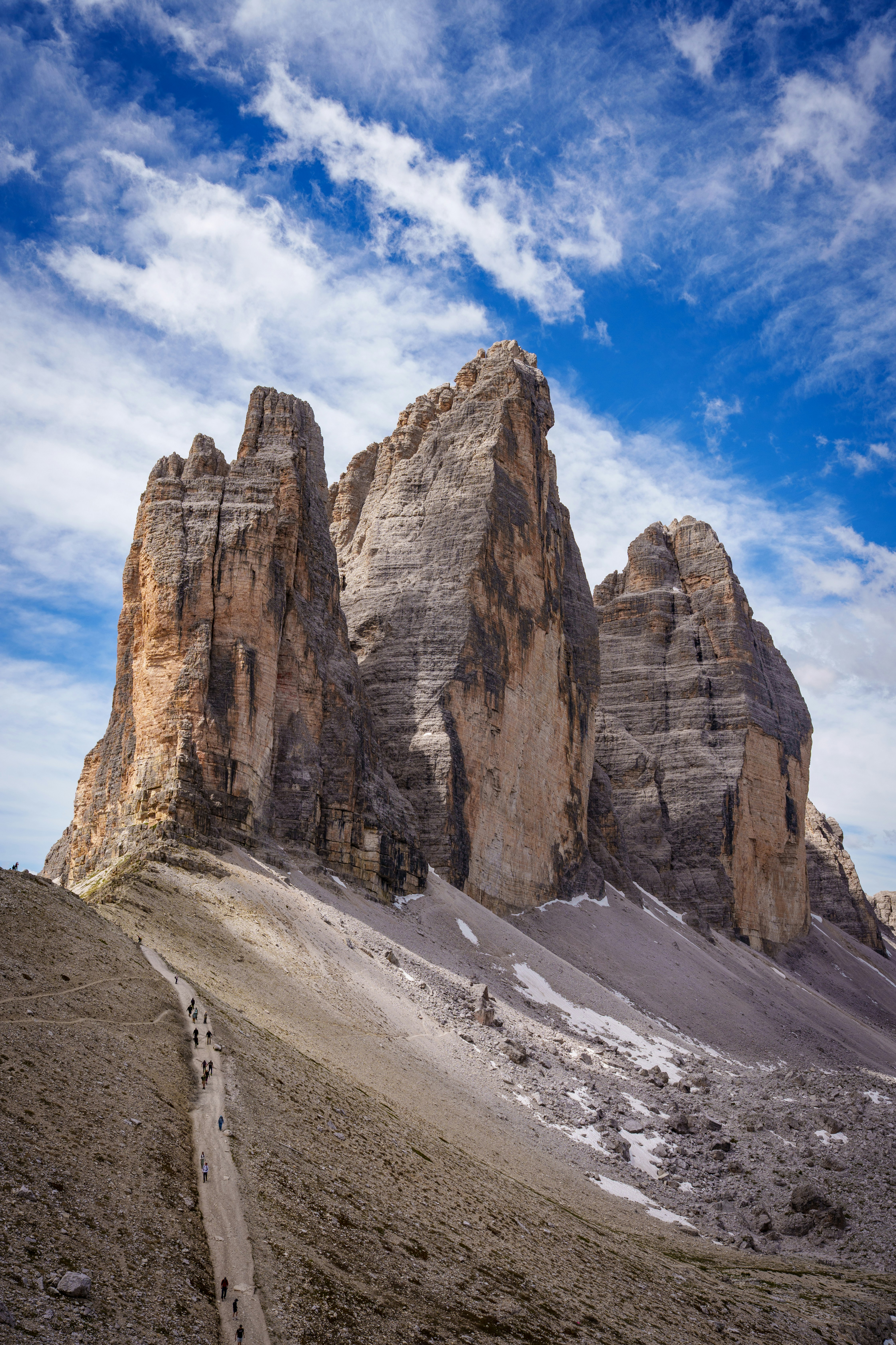 Twin Peaks of Granite Under a Vast Alpine Sky