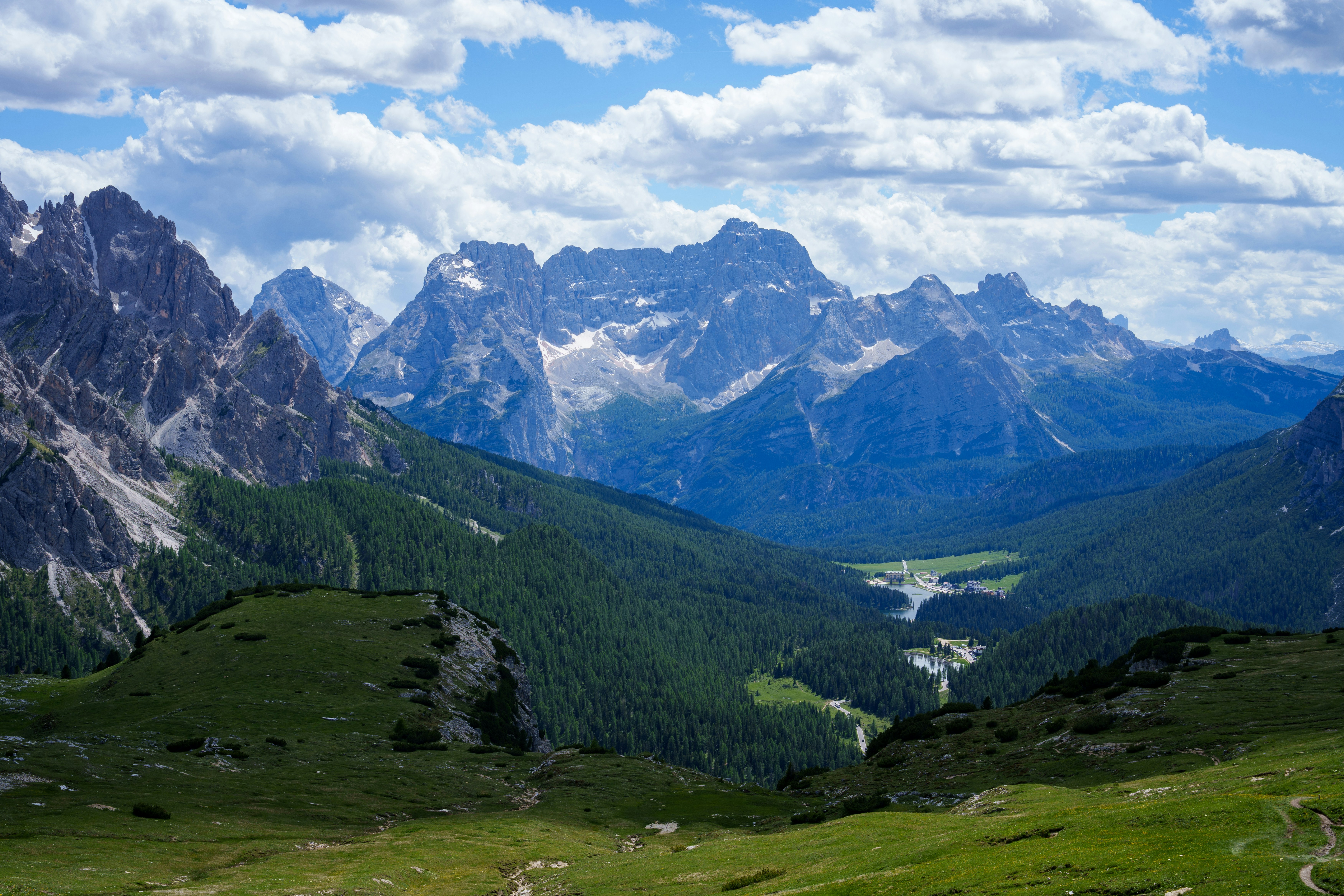 Valley Echoes: Alpine Crest Beneath a Crown of Clouds