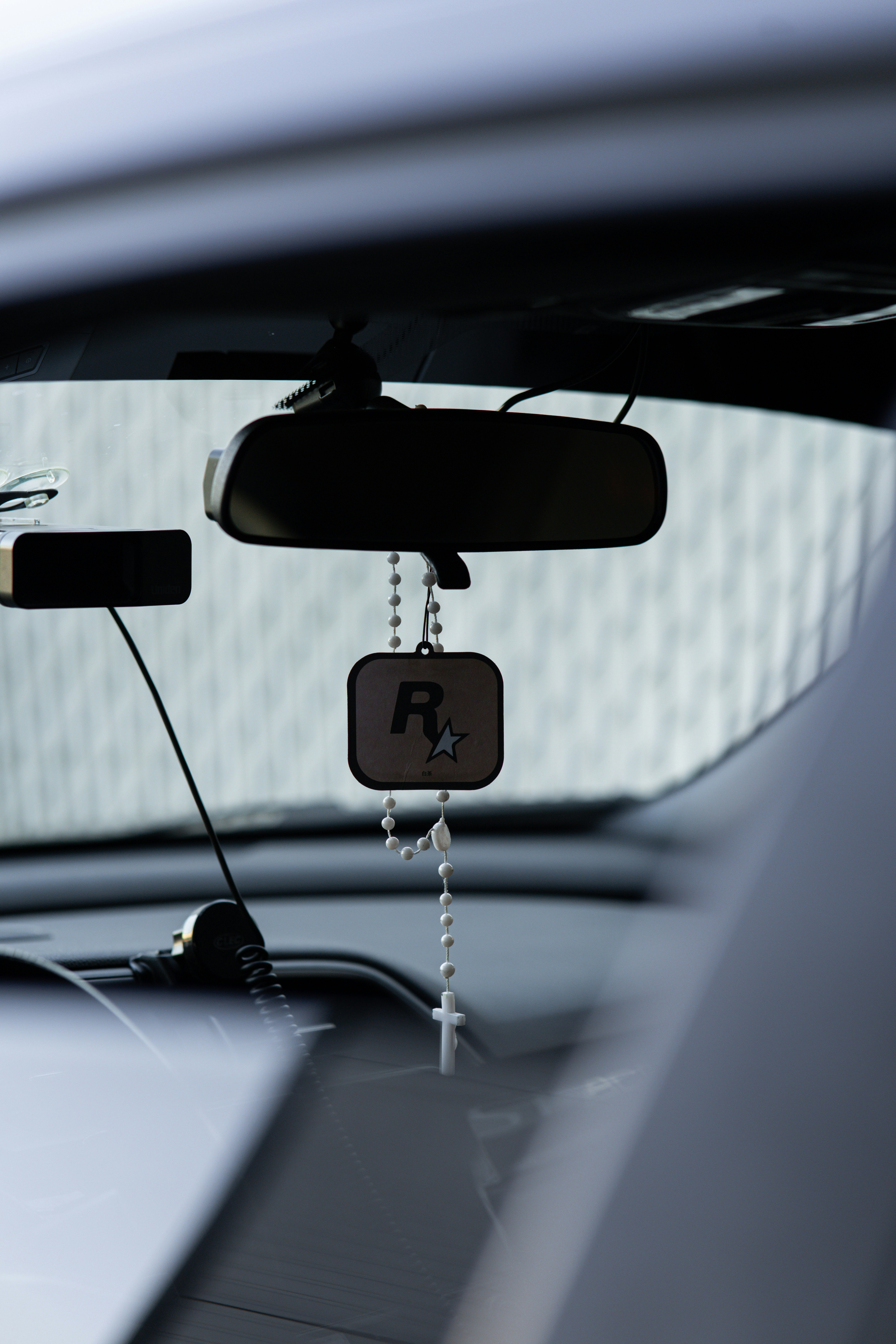Rearview Reverie: A Hangs-From-The-Front Mirror Scene