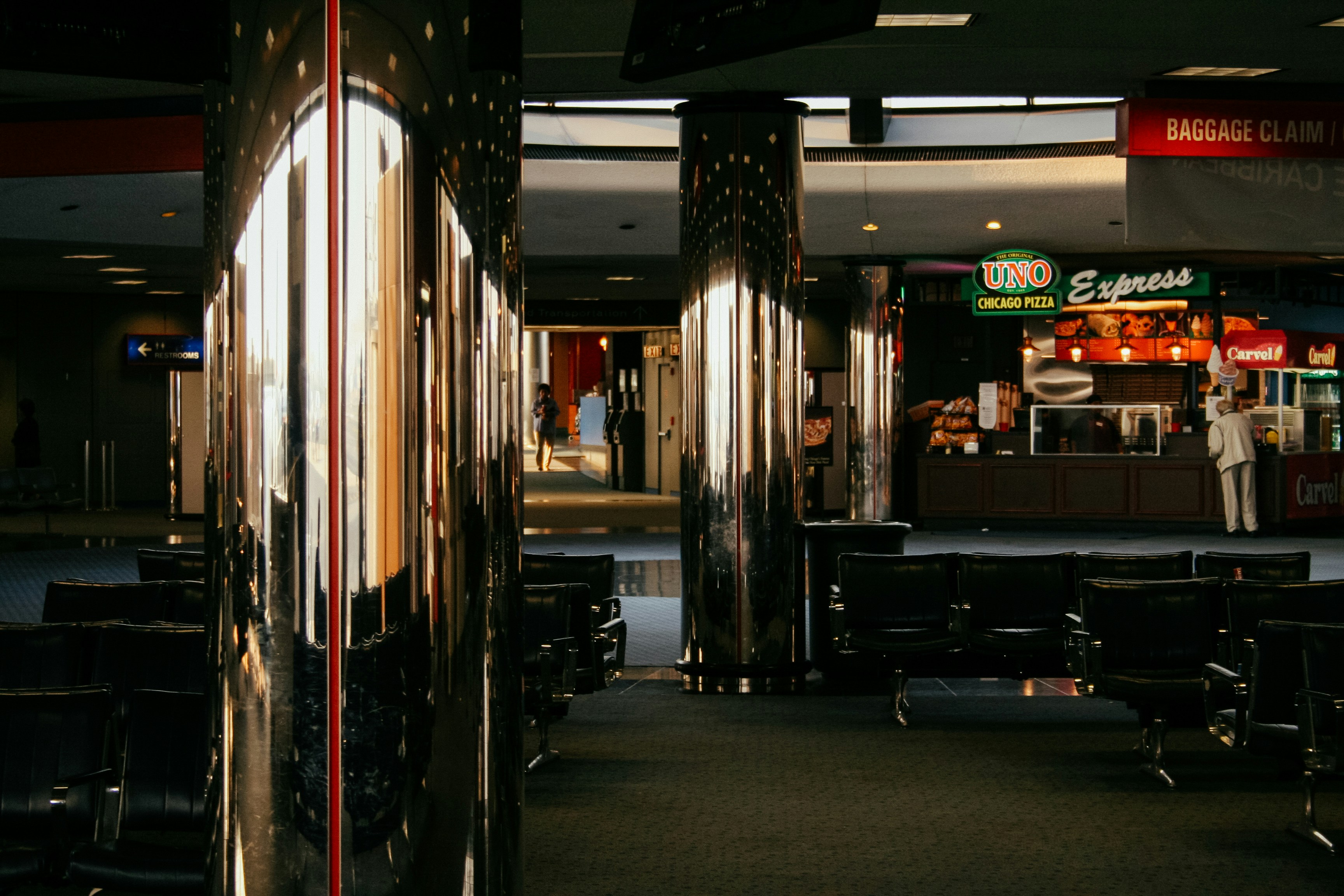 Terminal Echo: Neon Letters and Glass Converge in a Quiet Mall Corridor