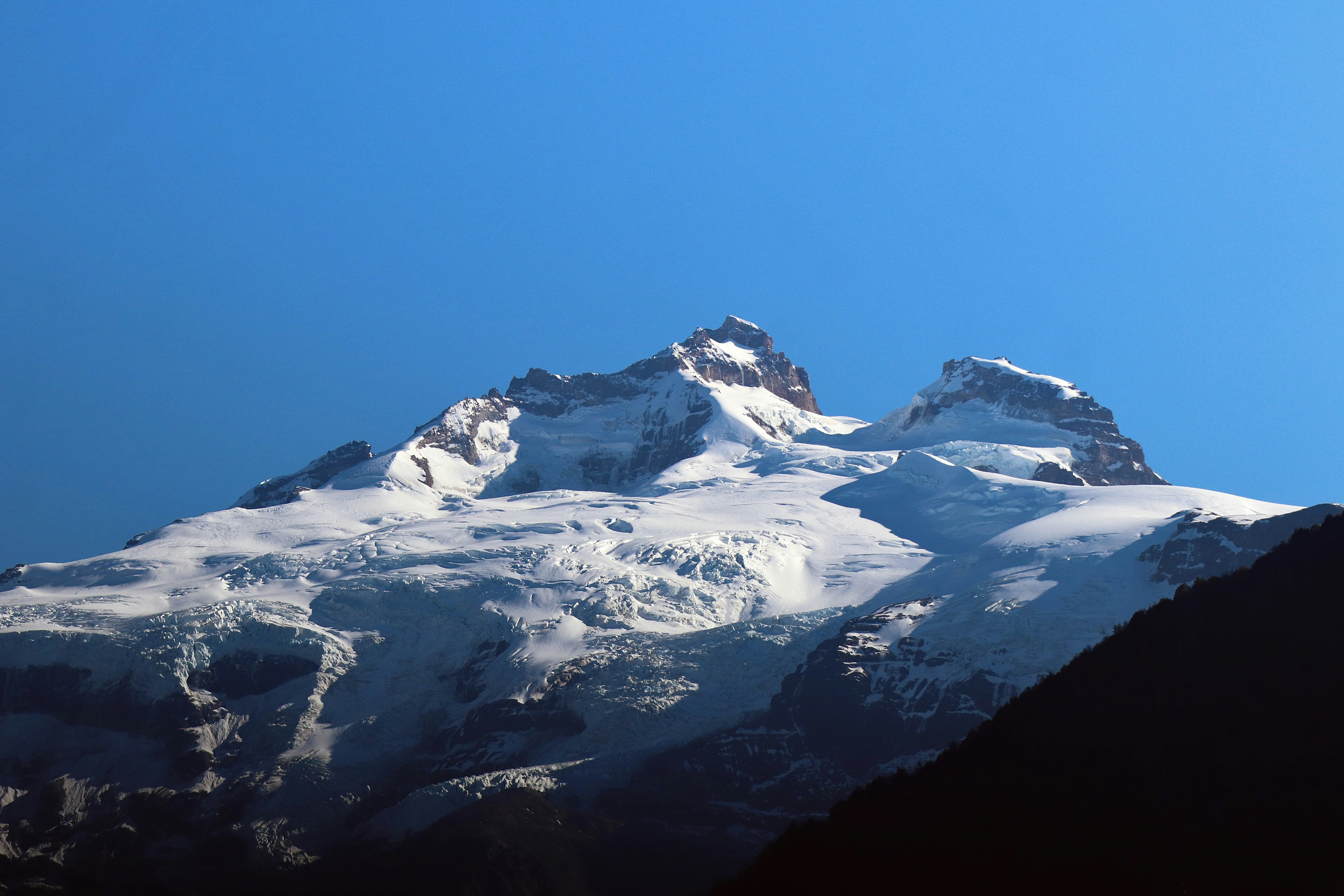 Snow-Crowned Peak Under Clear Alpine Sky