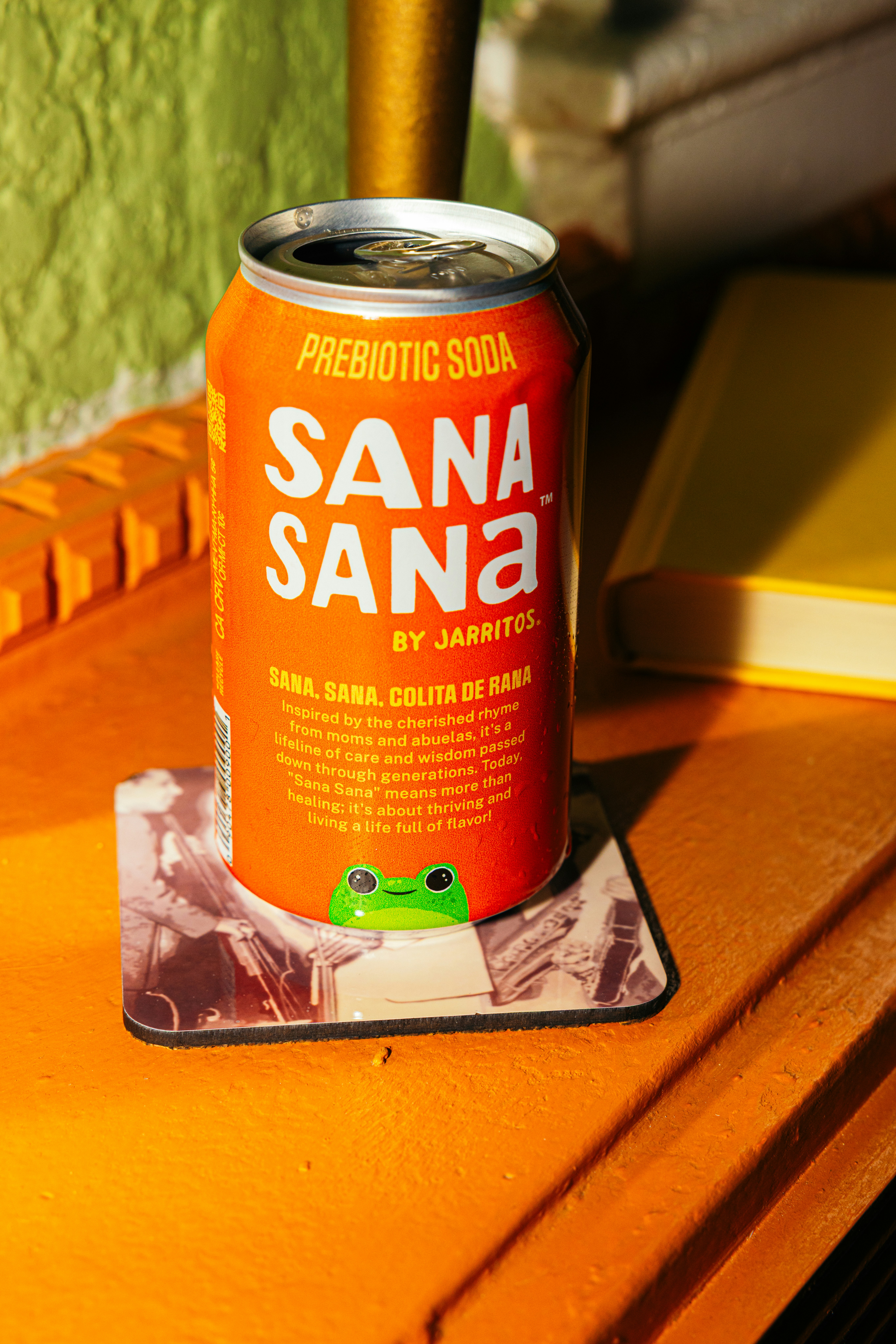 Orange Soda in Focus: A Can of Sana Sana with Frog Motif