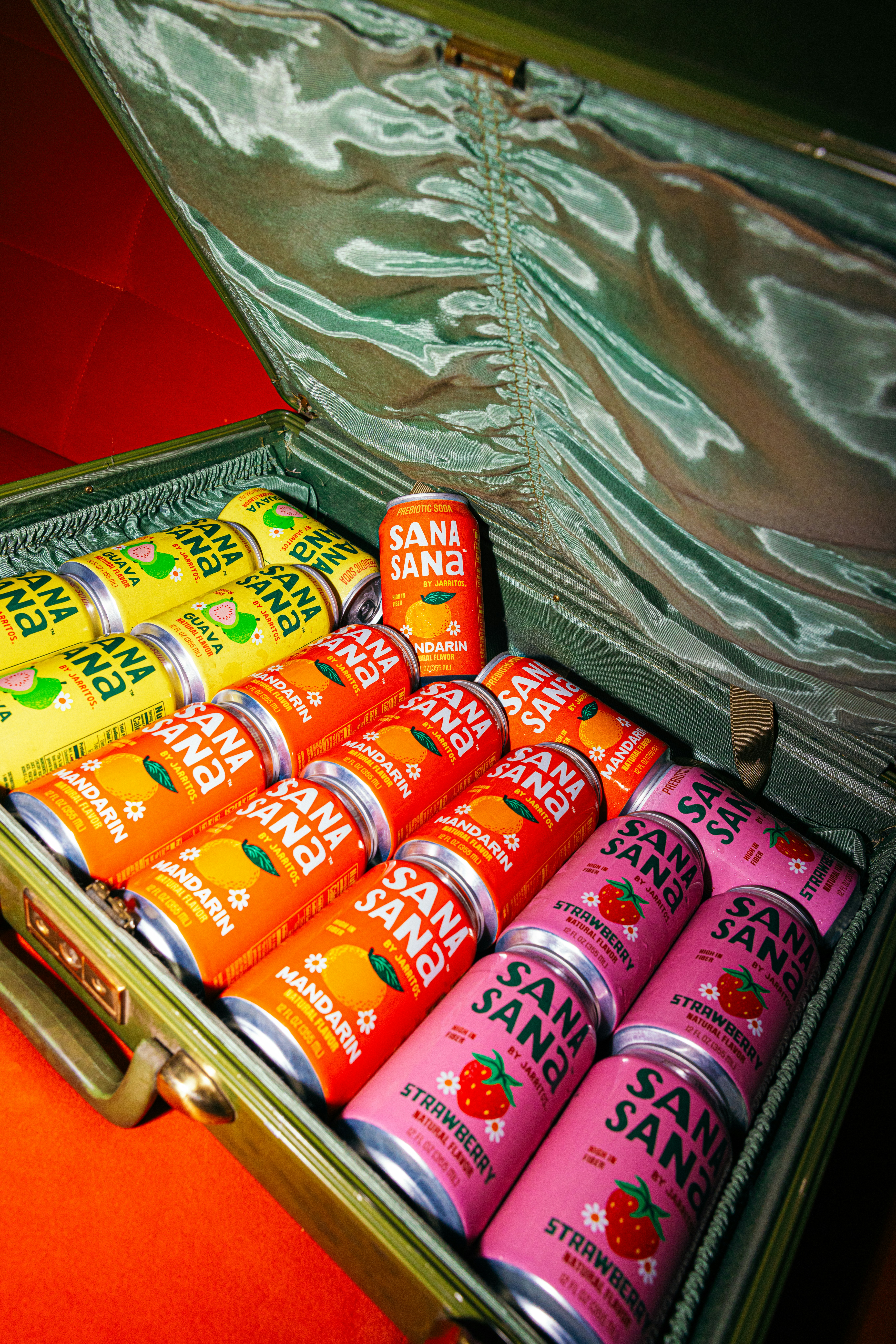 Vibrant metal chest of citrus SANA SANA beverages on display