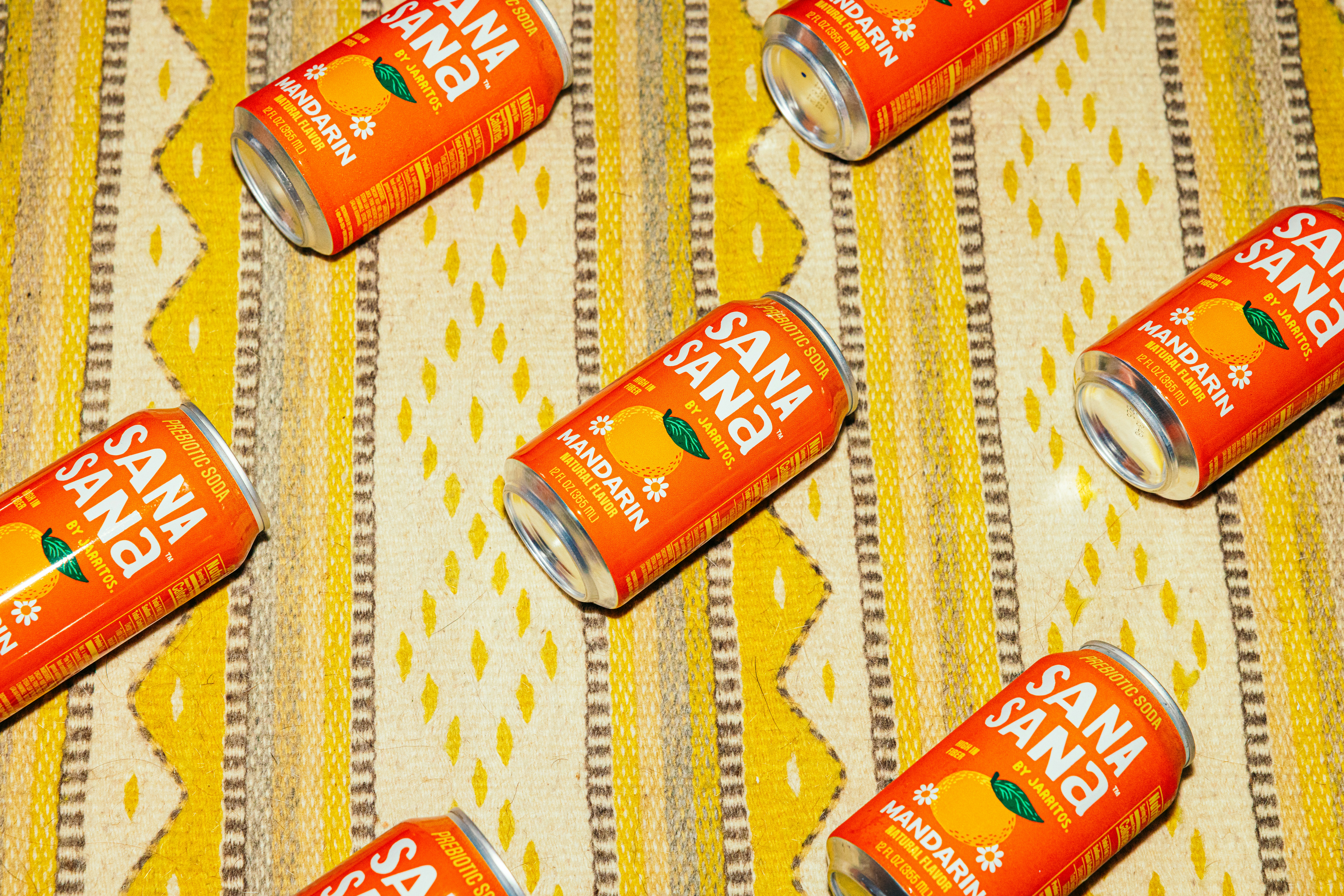 Orange Mandarine Spark: A Patterned Spread of Sani Mandan Cans