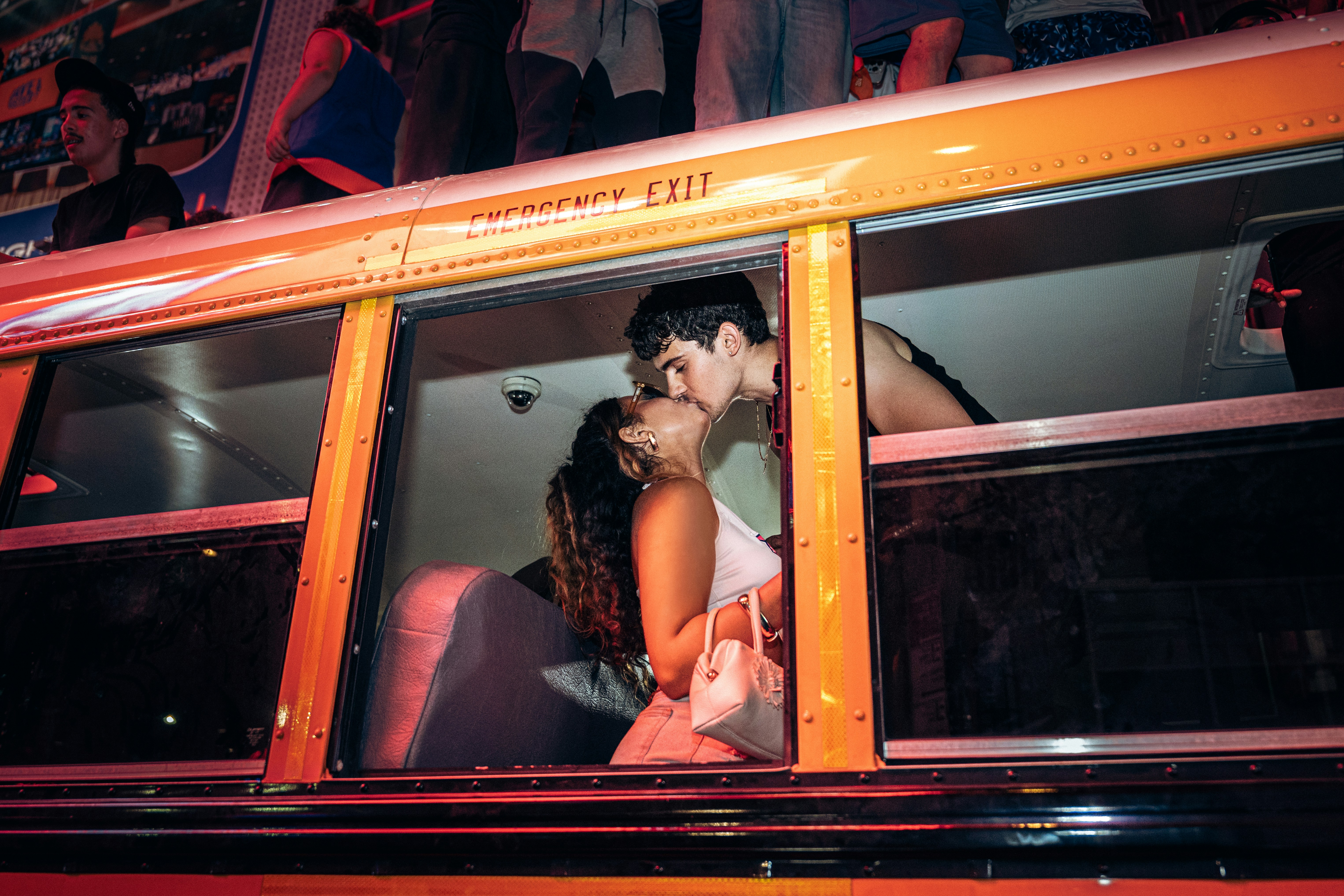 Midnight Kiss on a Neon Bus Window