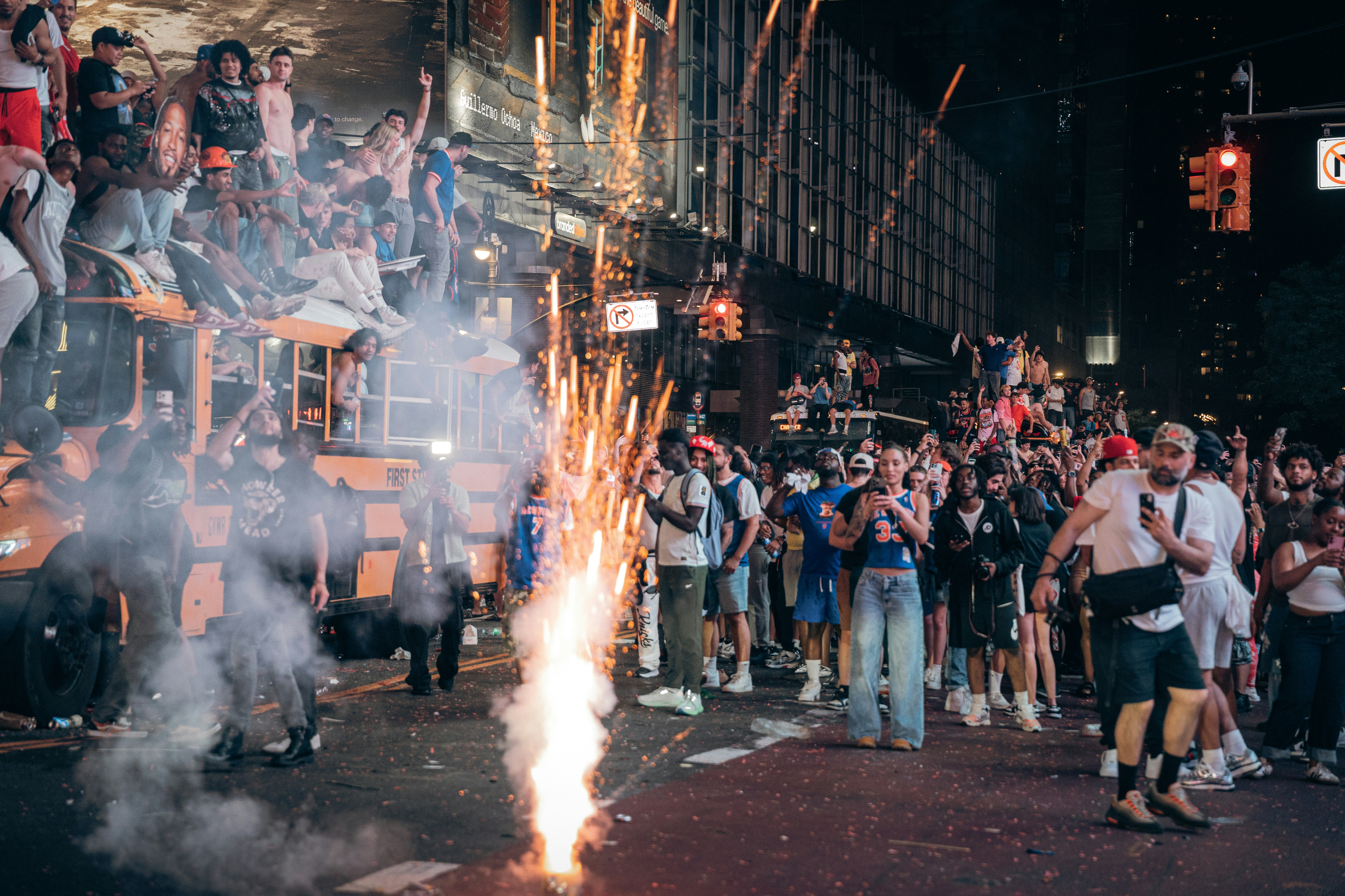 Pyrotechnic Pulse: Night Street Parade with Fireworks and Dense Crowd