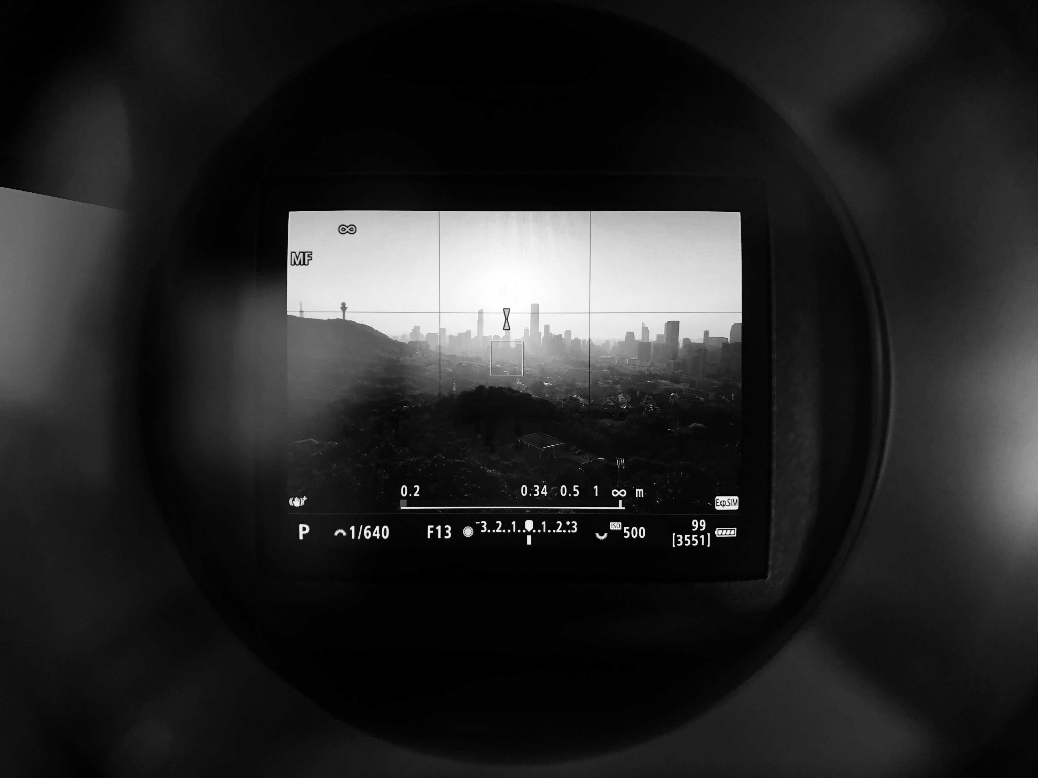 Through the Lens: Cityscape Framed in a Pin-Hole Viewfinder