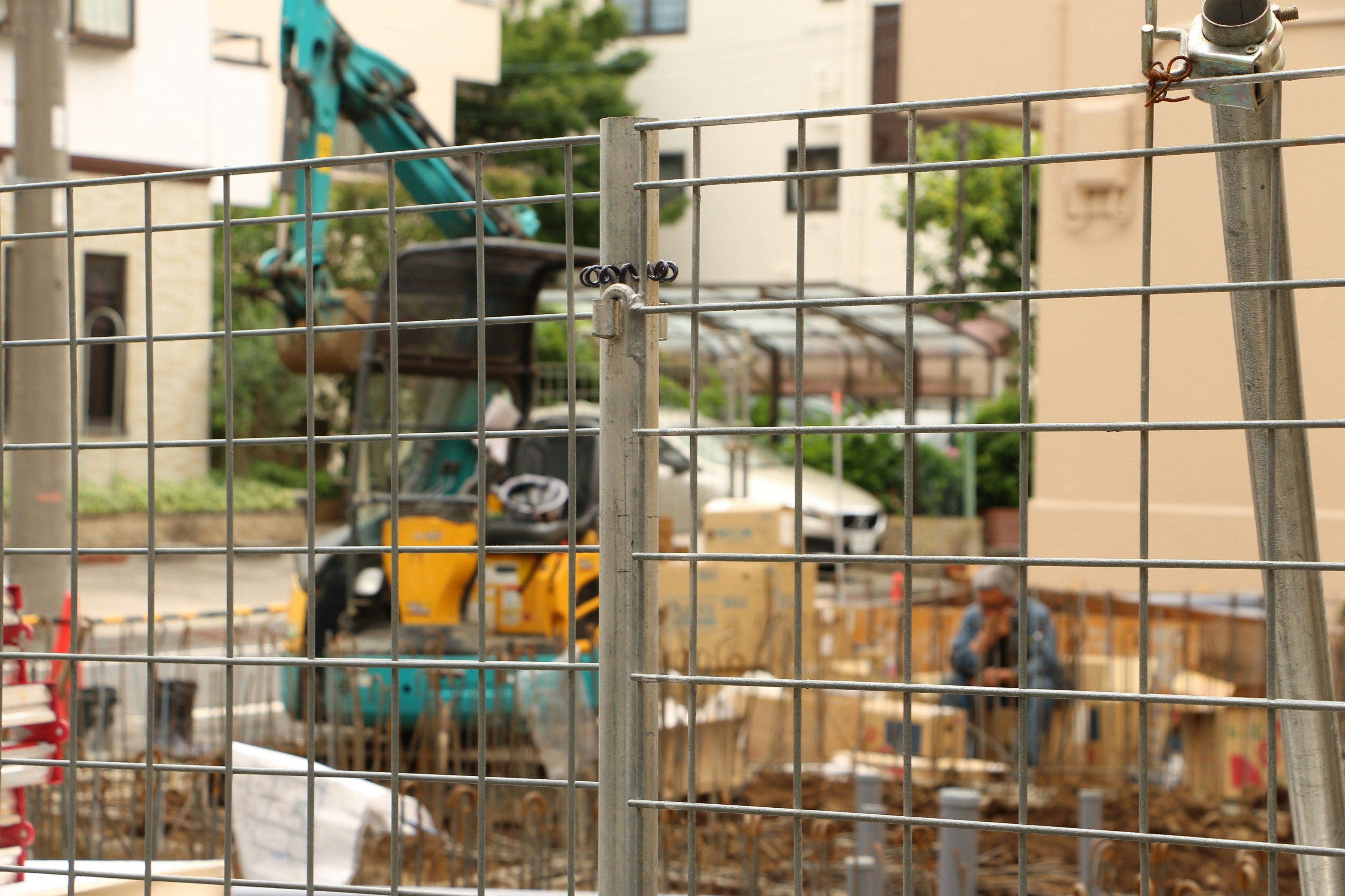 Construction Fence Portrait: Through the Barrier to the Workspace Scene