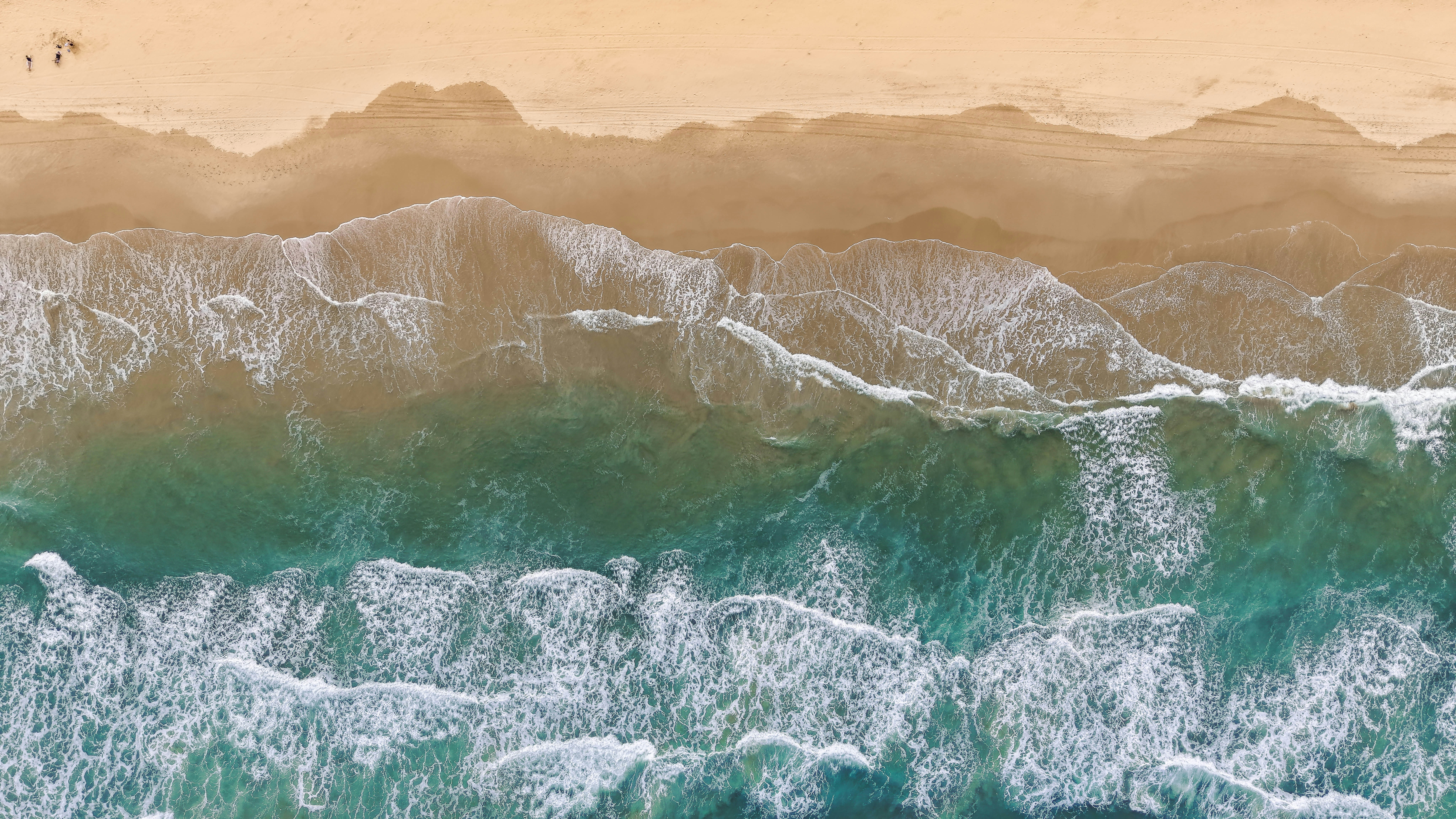 Coastal Crest: Aerial Waves Between Sandbar and Sea