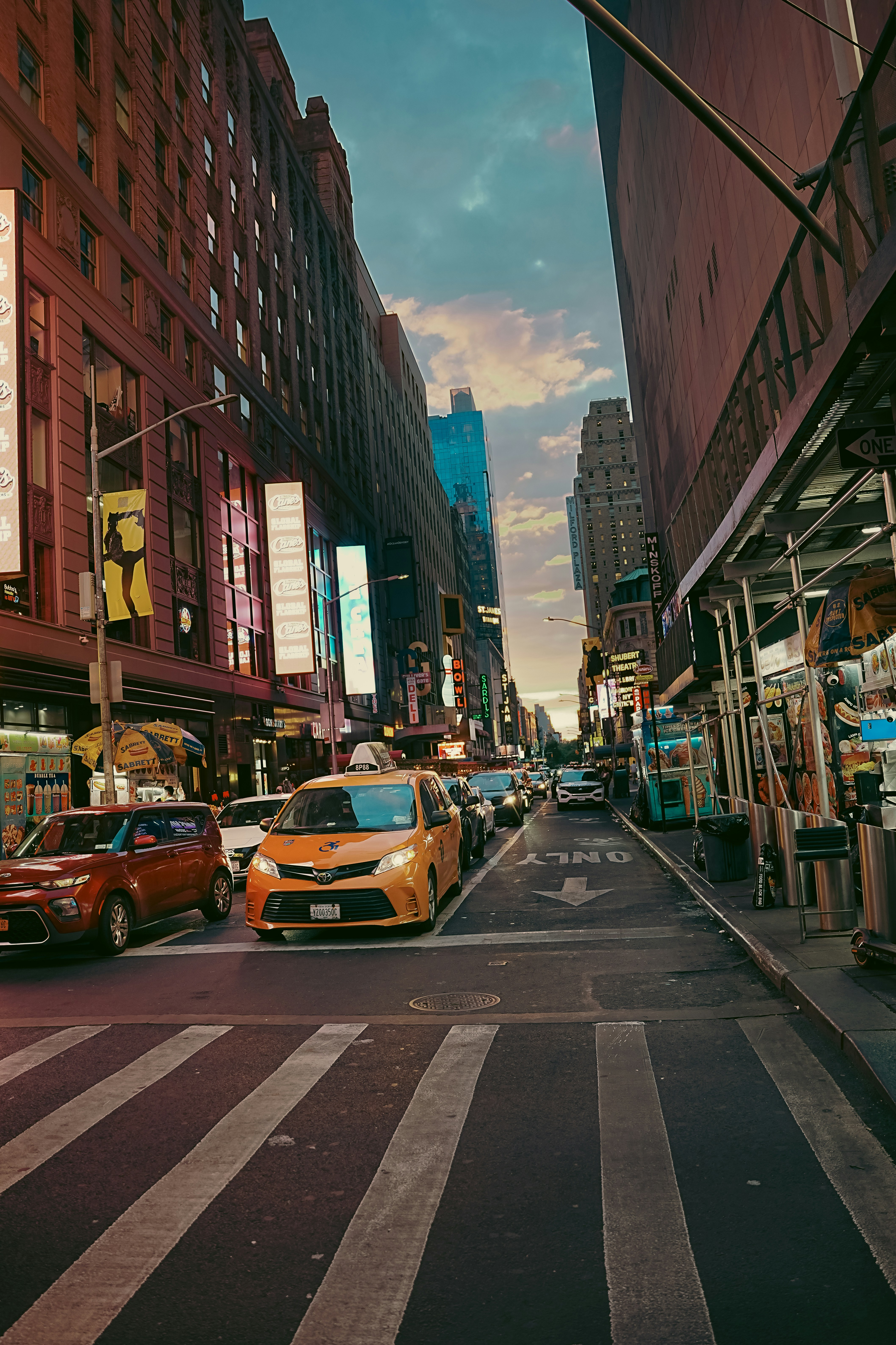 Midtown Pulse: A Yellow Cab Leading the Street Saga
