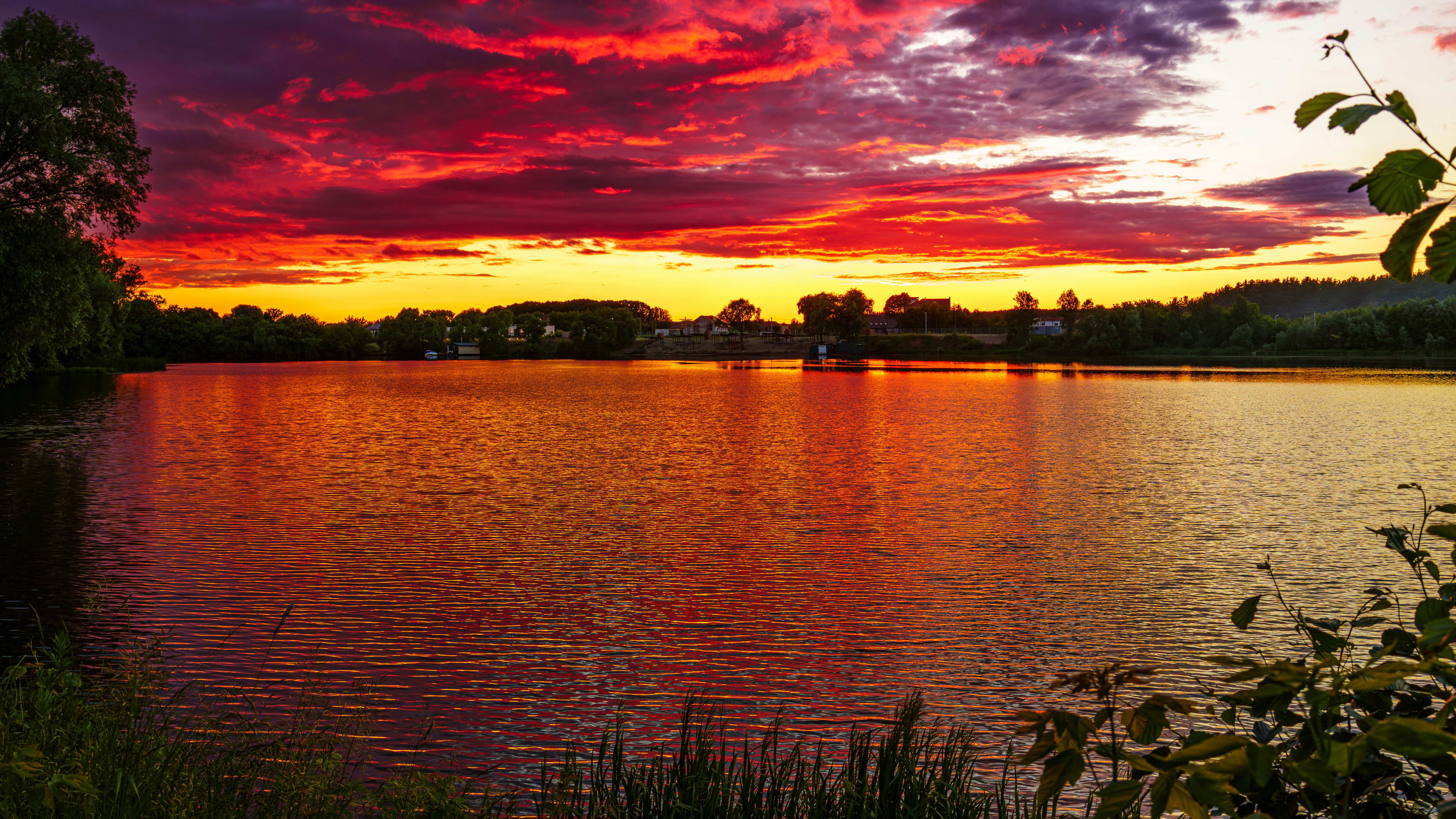 Sundown on the Quiet Lake: Fire in the Sky Over Glassy Waters
