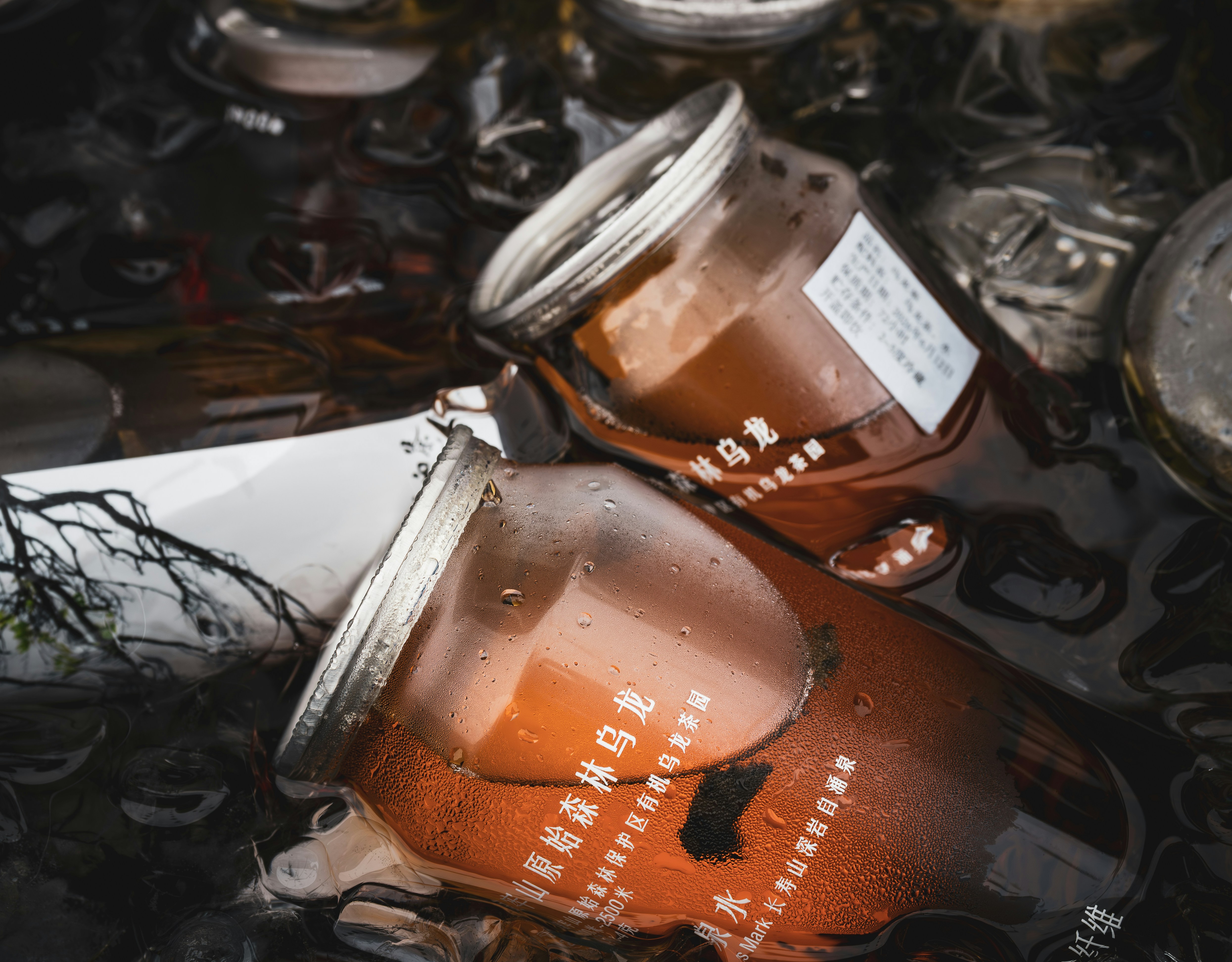 Gluey Oasis: Ruby Jars Bobbing in Dark Syrup