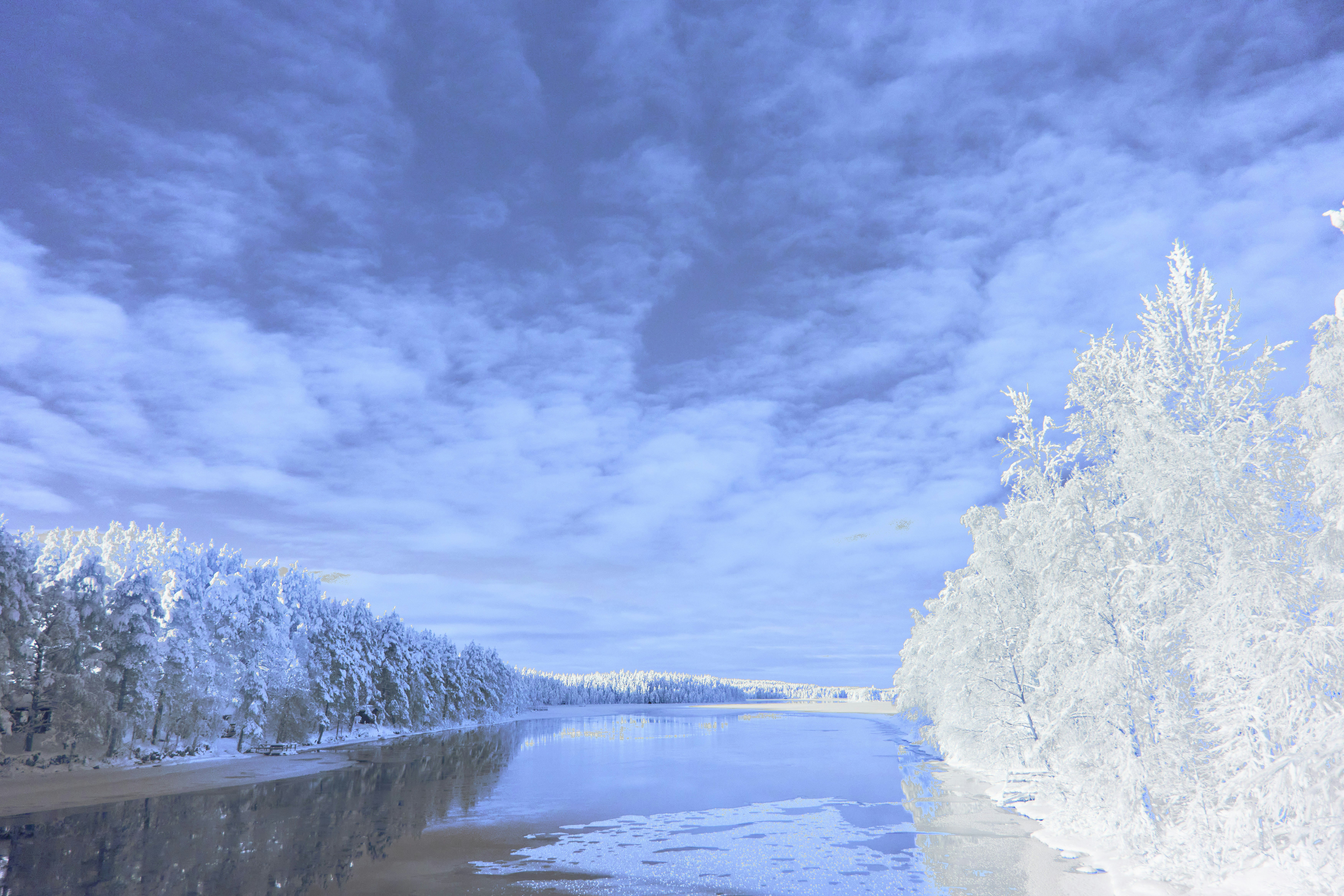 Icy River Corridor under a Bright Winter Sky