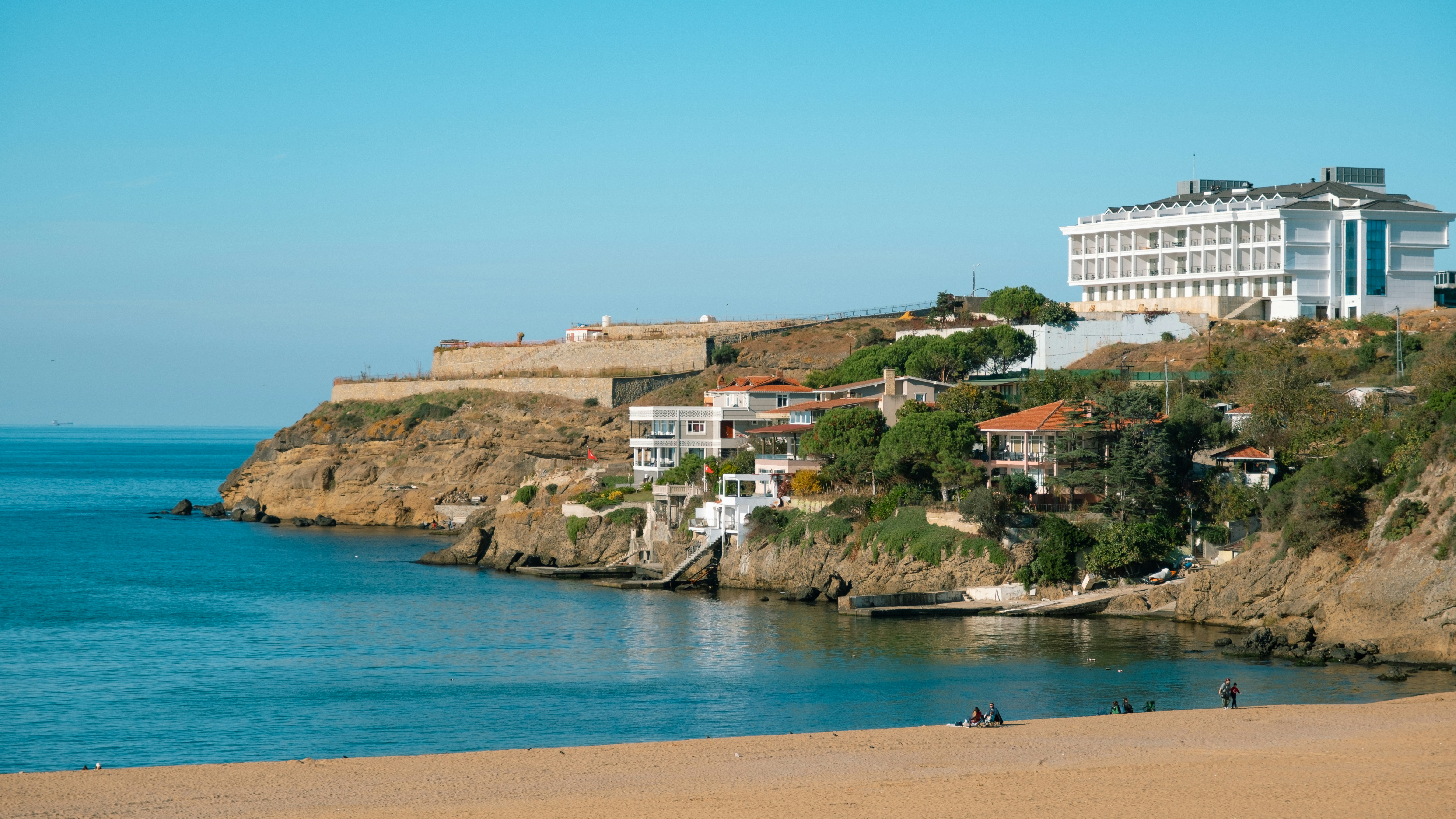 Sunlit Coastal Village Rise Above the Sea