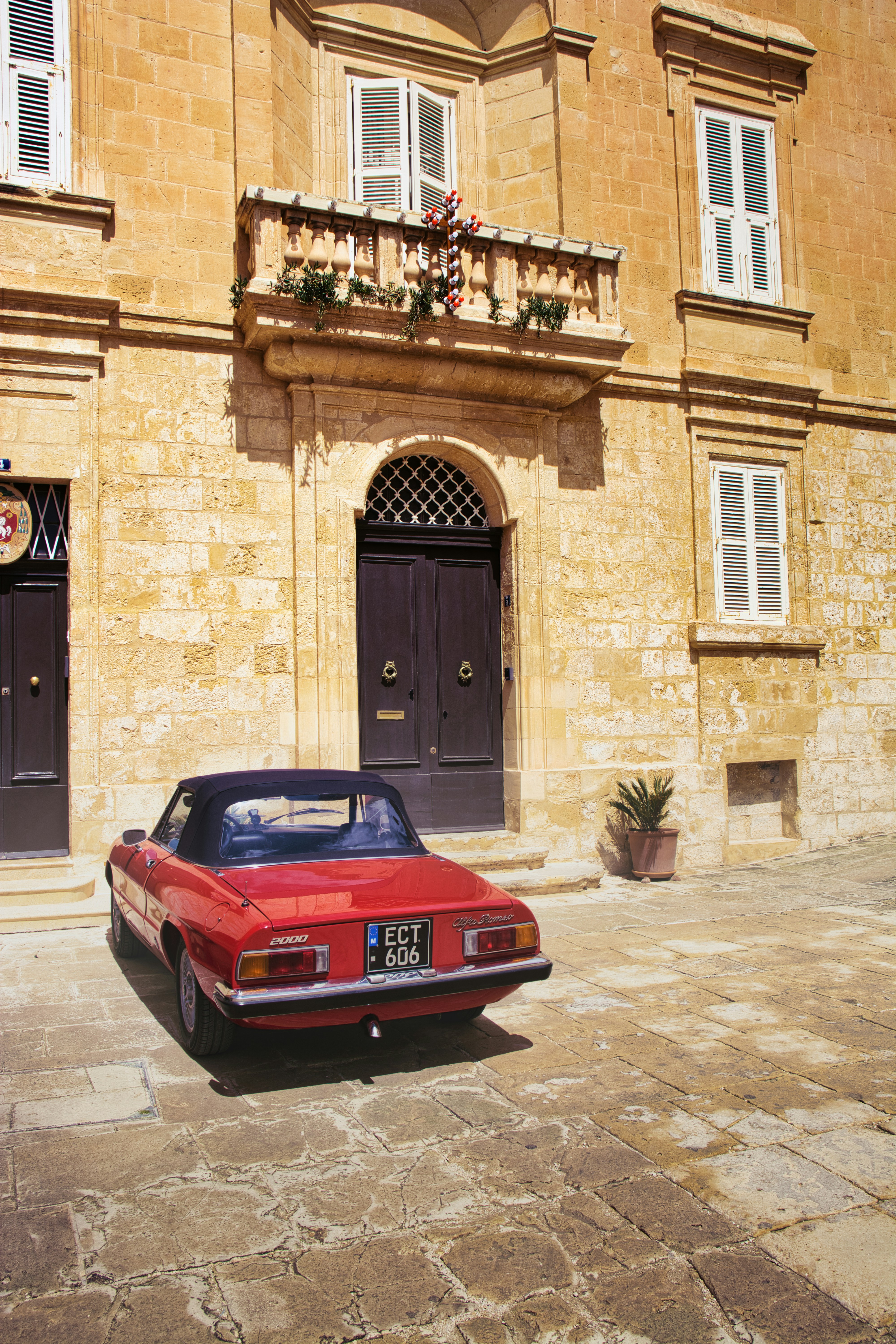 Red Classic in a Limestone Street