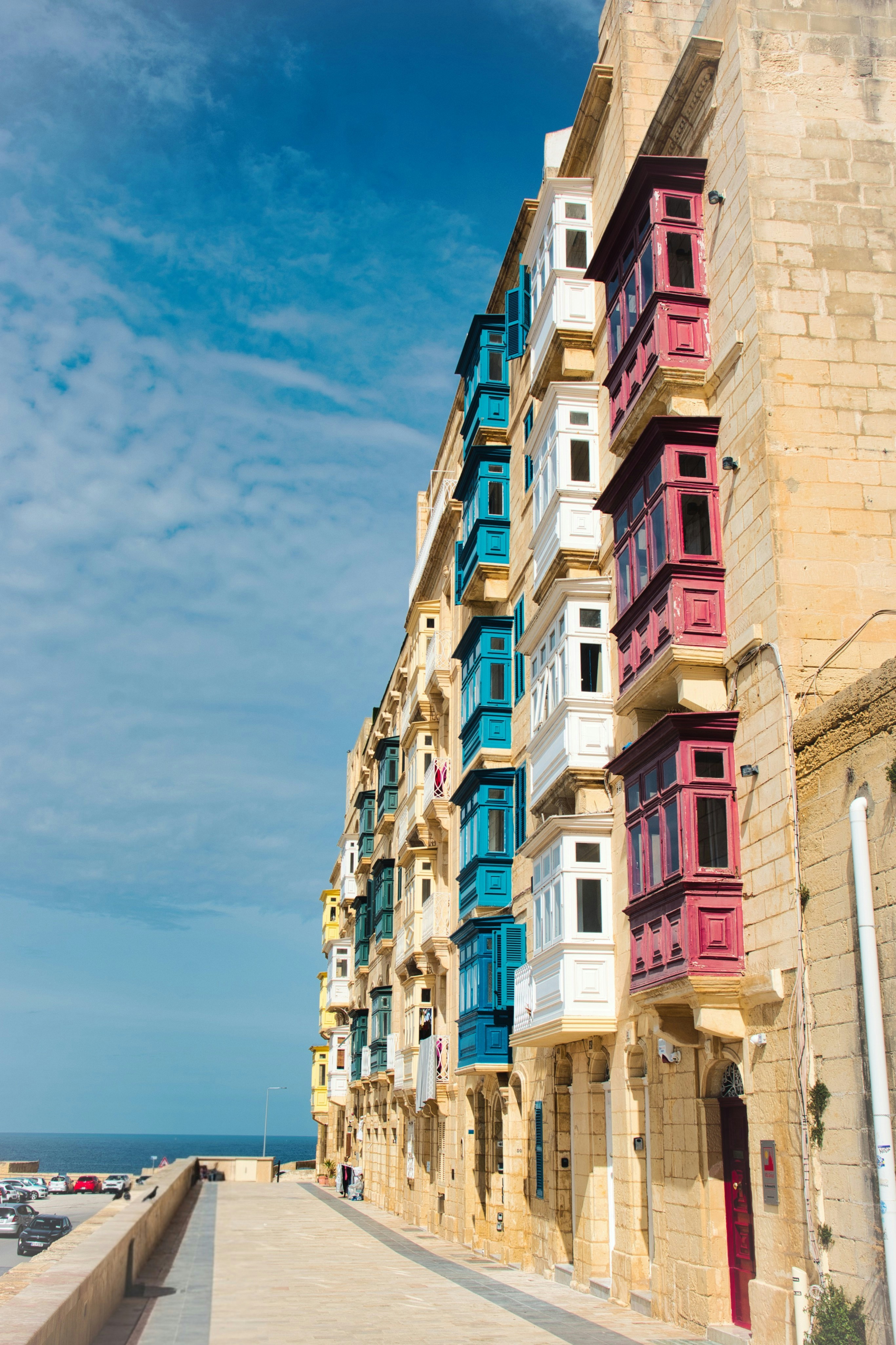 Colorful Balconies Crown the Limestone Seaside Street