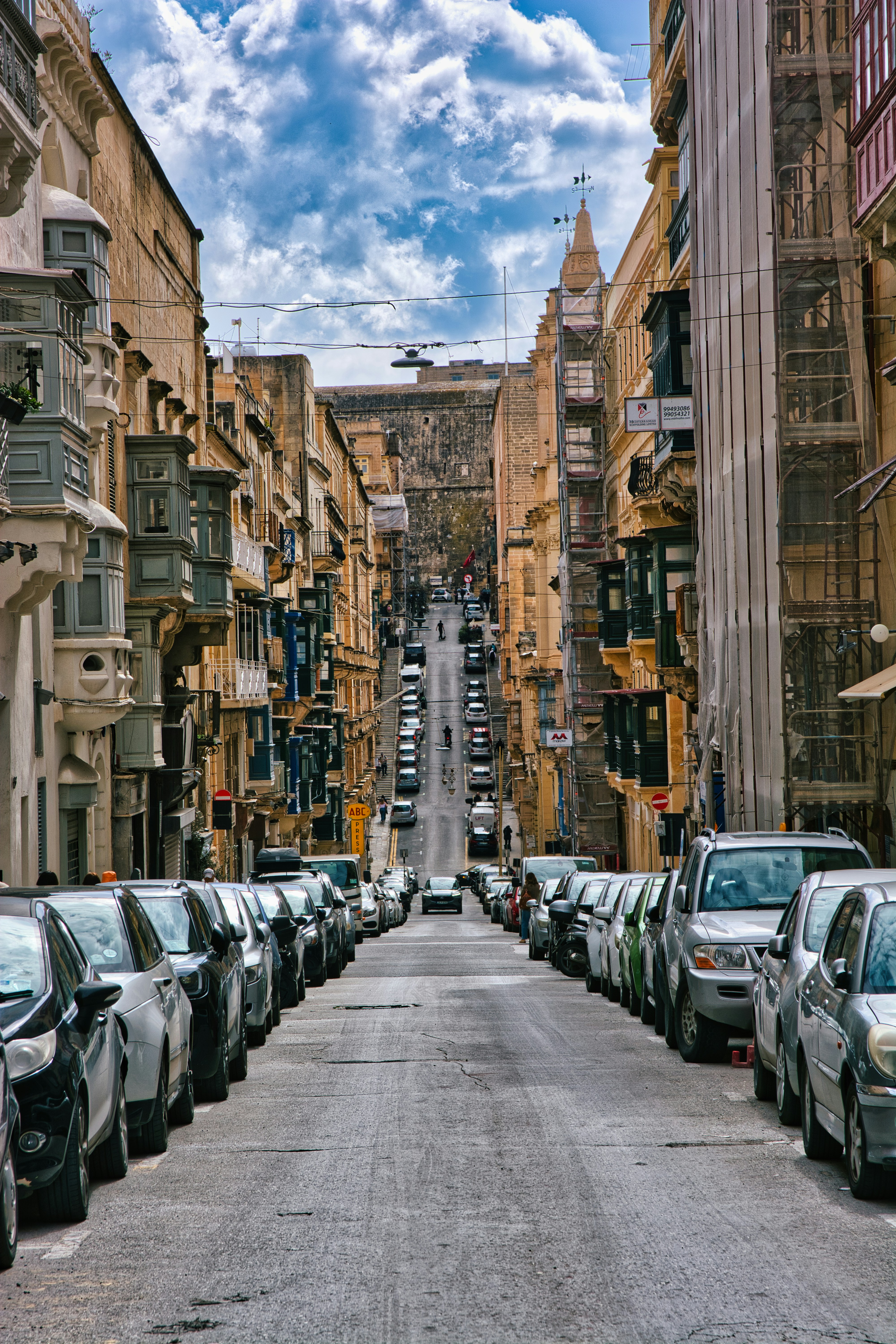 Urban Canyon: A Narrow Street Reaching Toward the Skyline