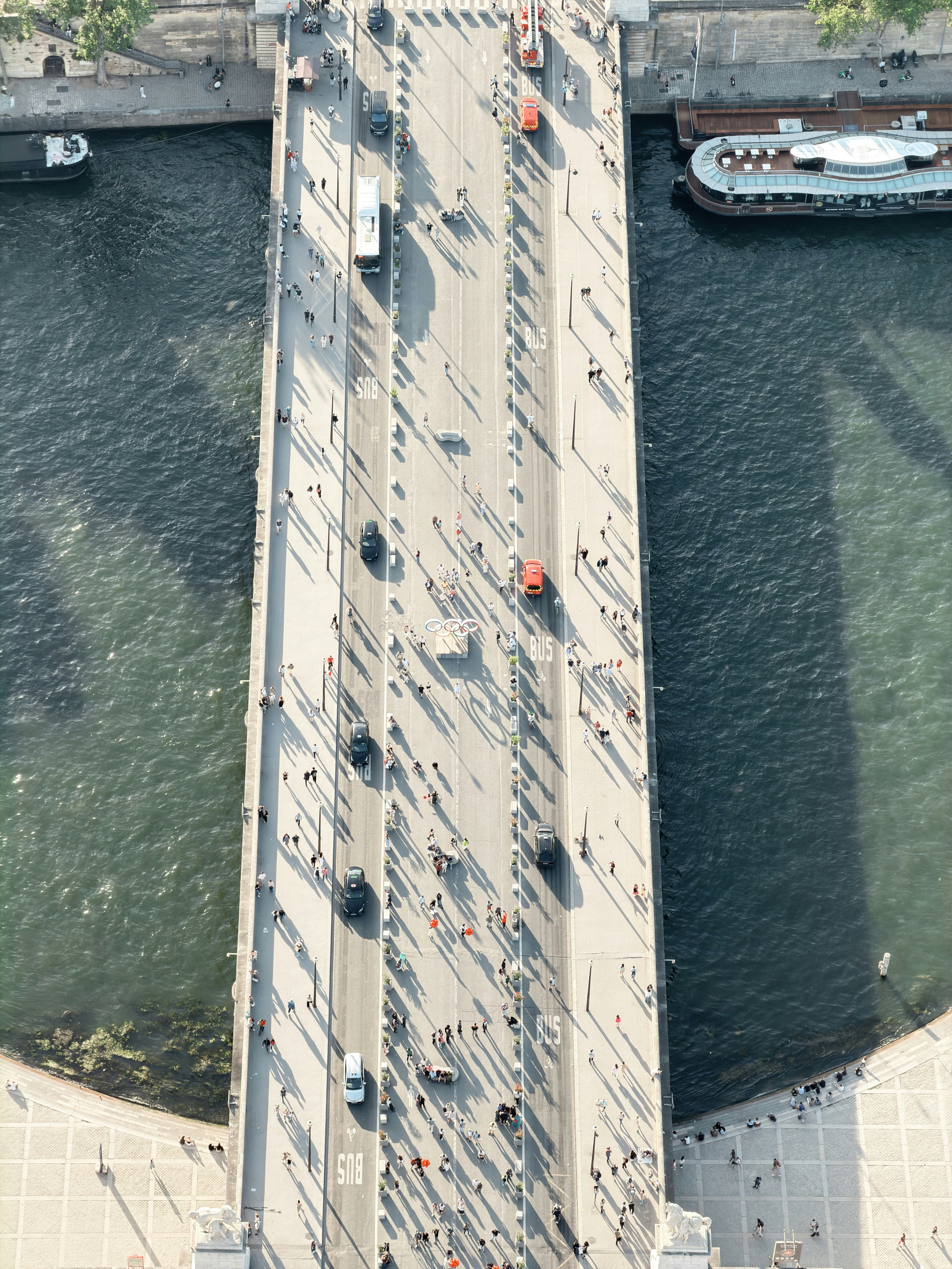 Aerial Crossing: Minimal Hero on a Busy River Bridge