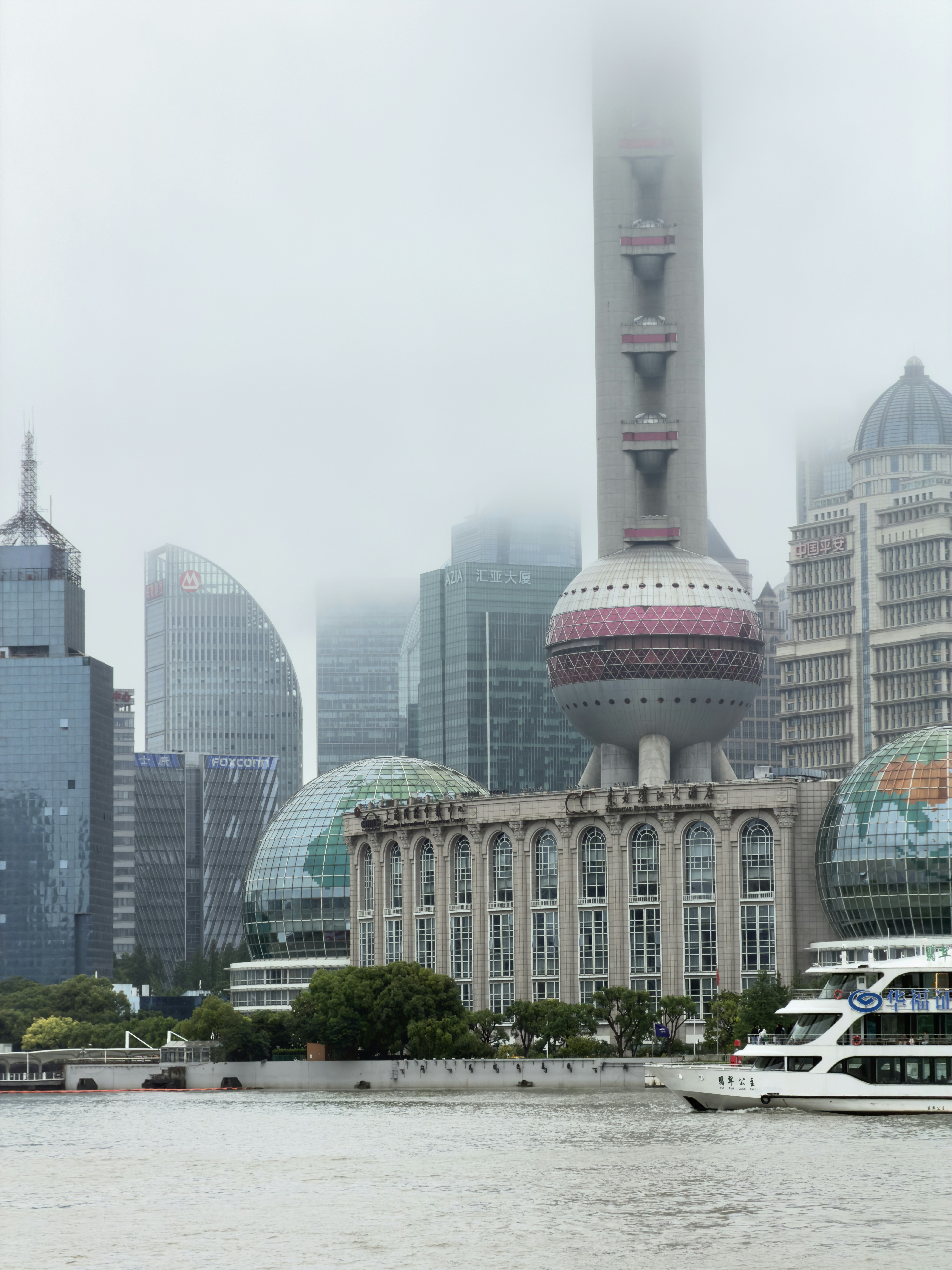 Mist over the Bund: Shanghai's Skyscraper Parade Emerges from Fog