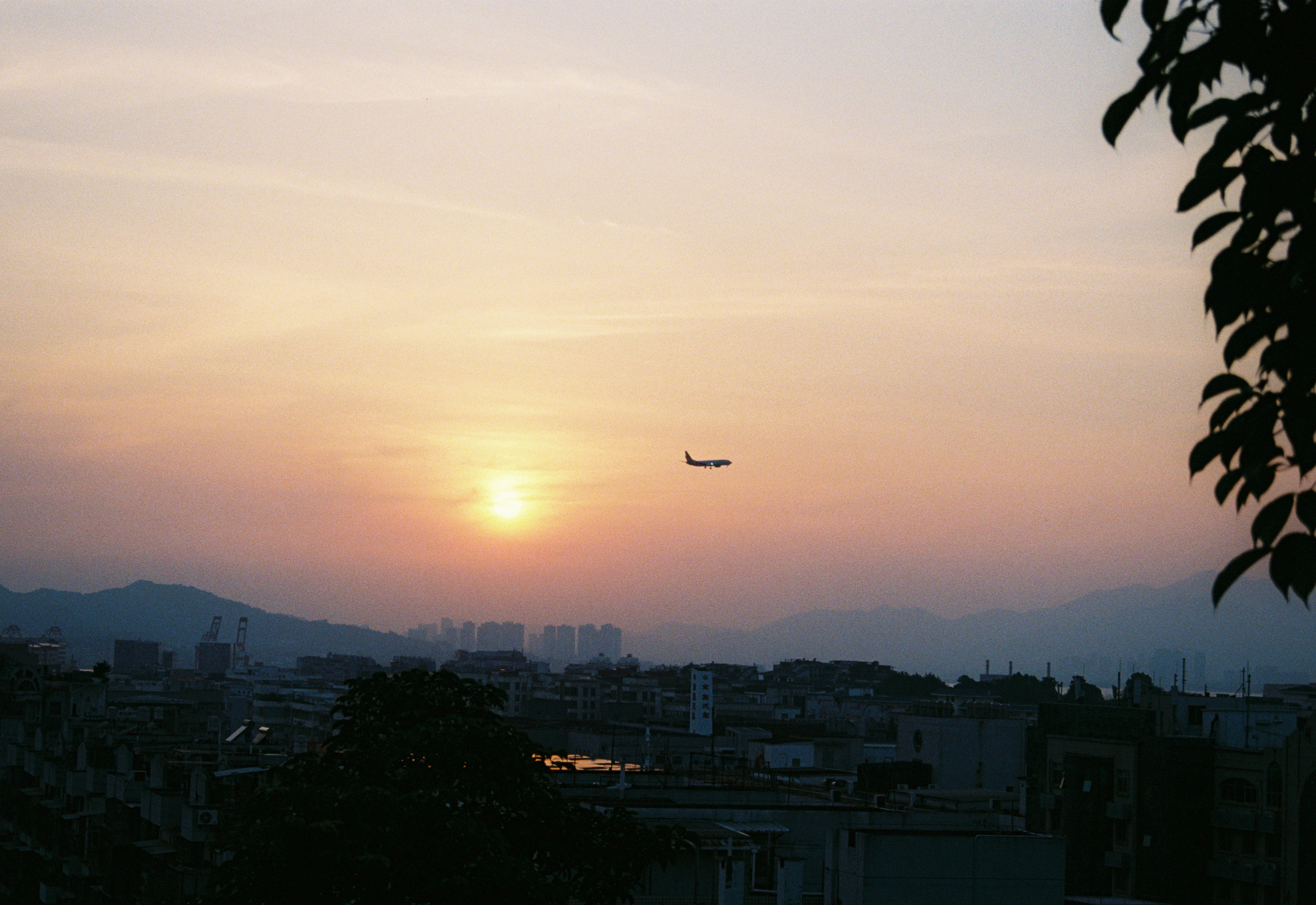 Sunrise Flight Over a Quiet City Horizon