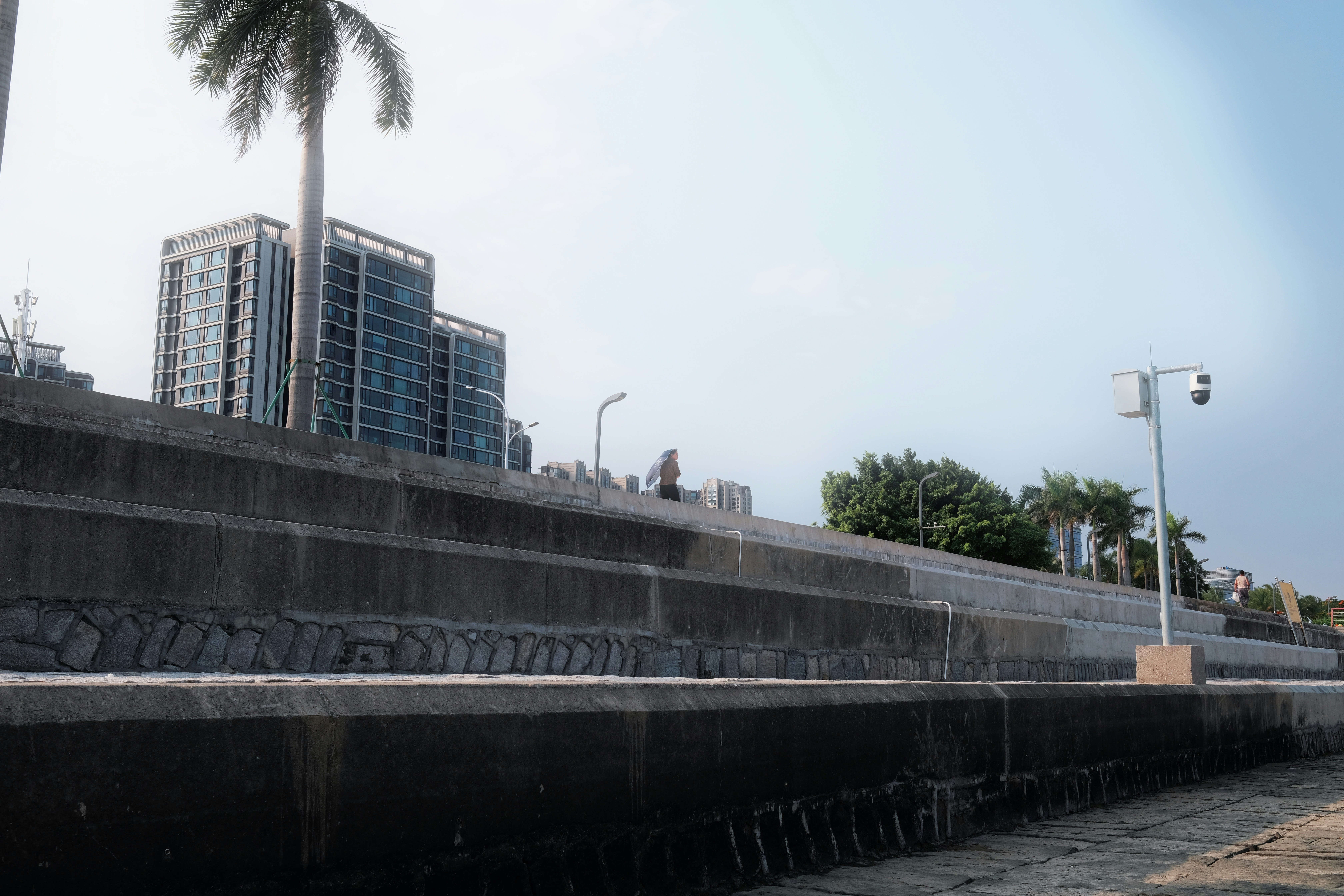 Terraced Waterfront Promenade Under Quiet Blue Skies