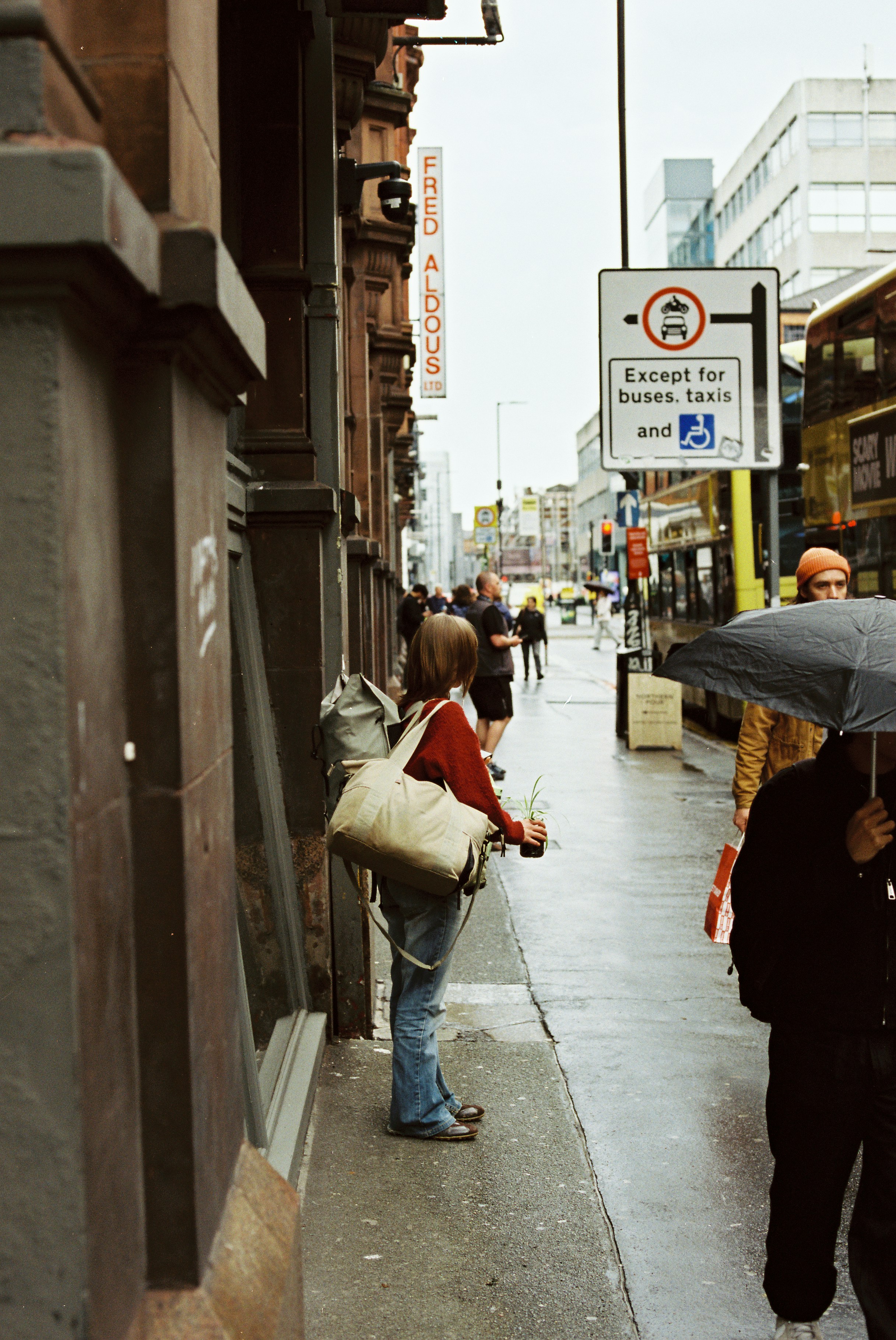 Street Silhouette: A Quiet Moment Amid City Rain