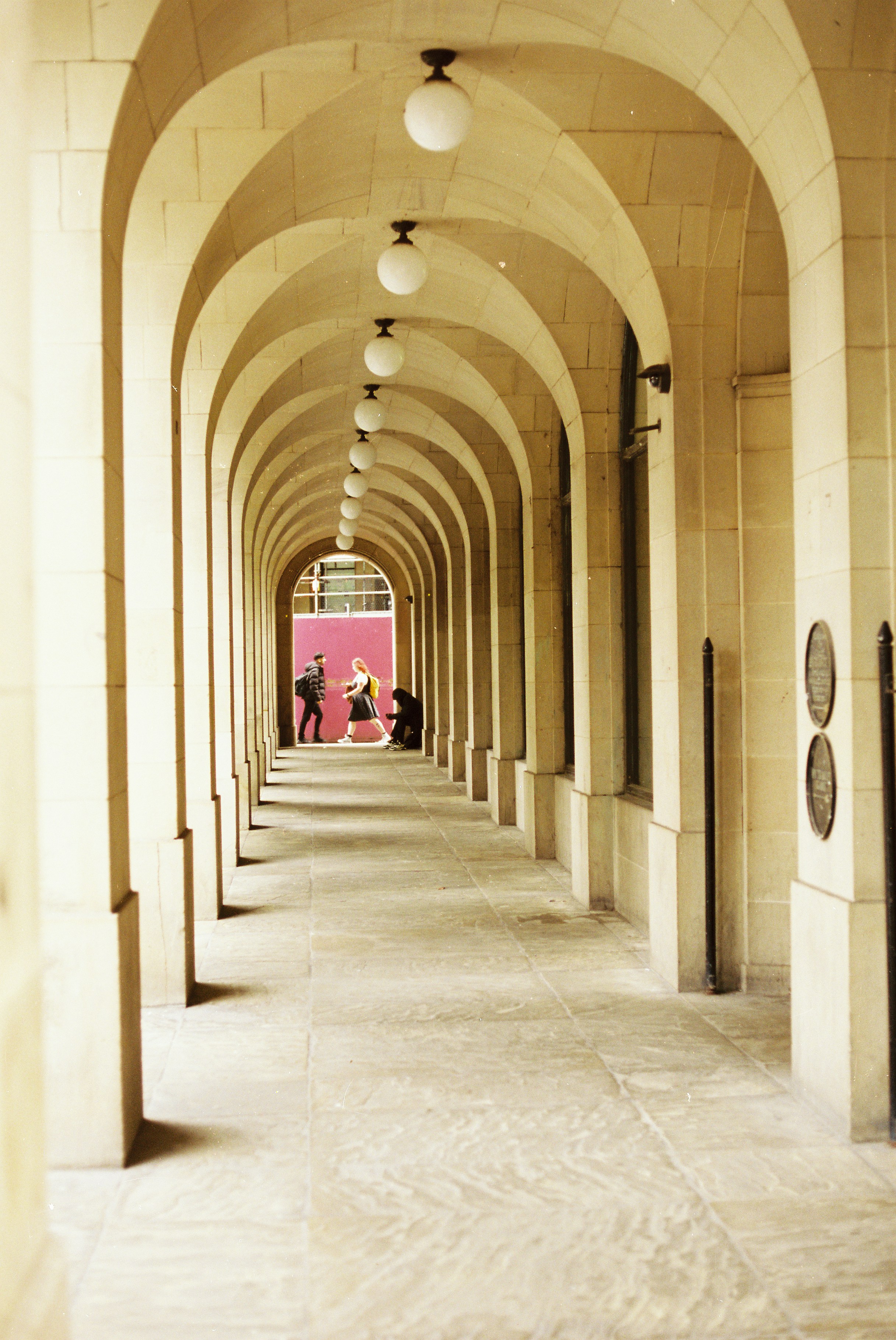 Archway Corridor: A Sunset Walk Through Symmetry