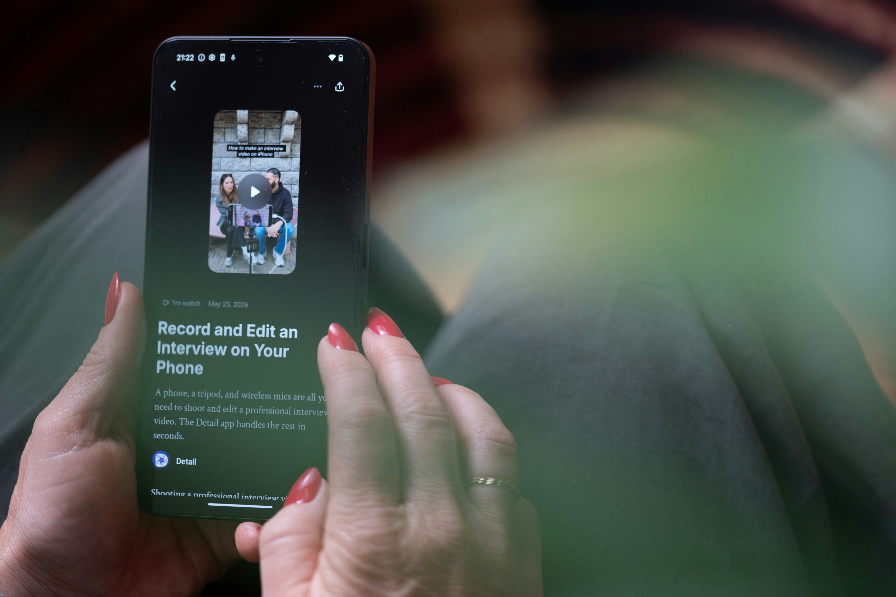 Hands Frame a Phone Screen: Soft Focus Portrait within a Busy Background