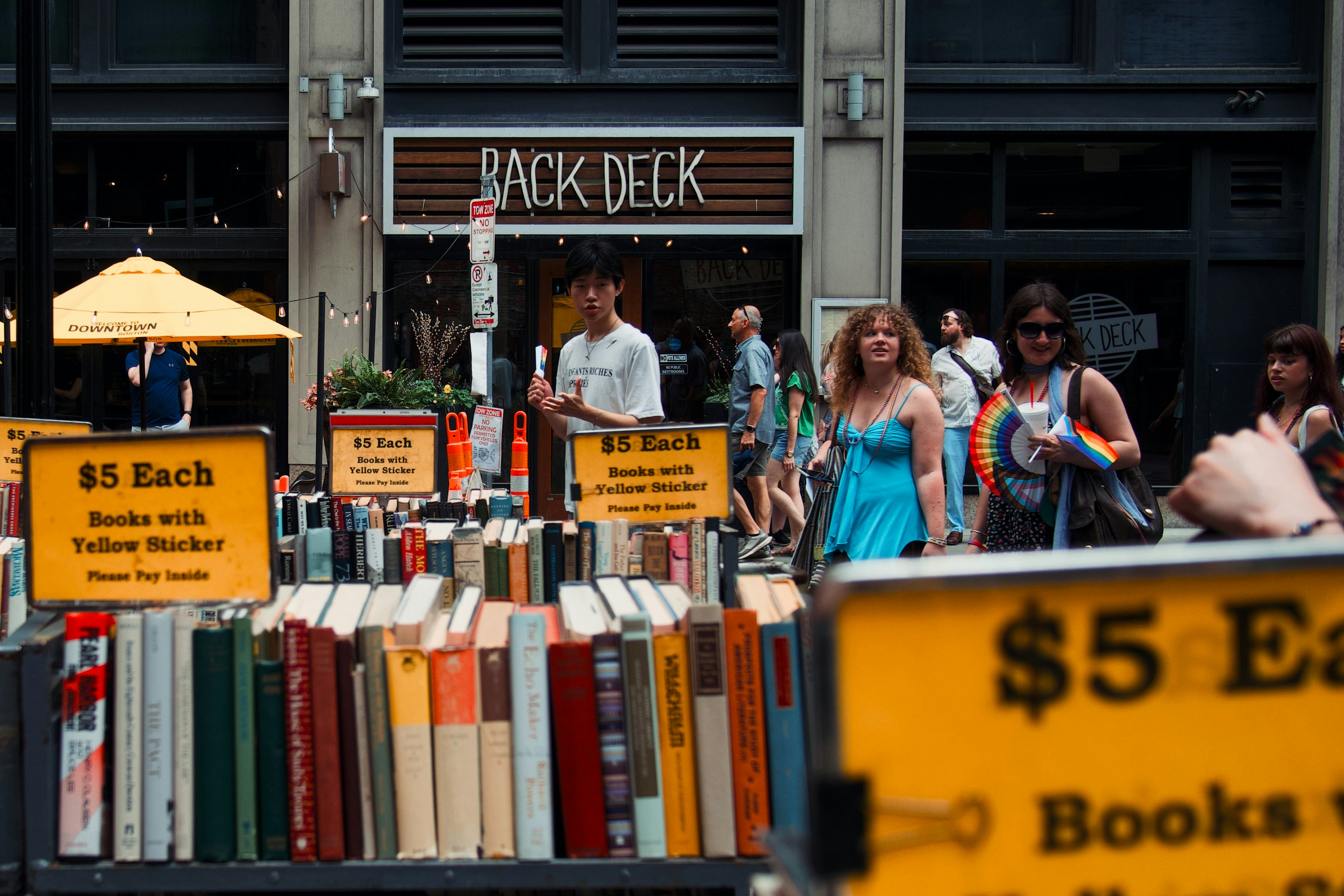 Books and Bystanders: A Busy Moment at the Street Market