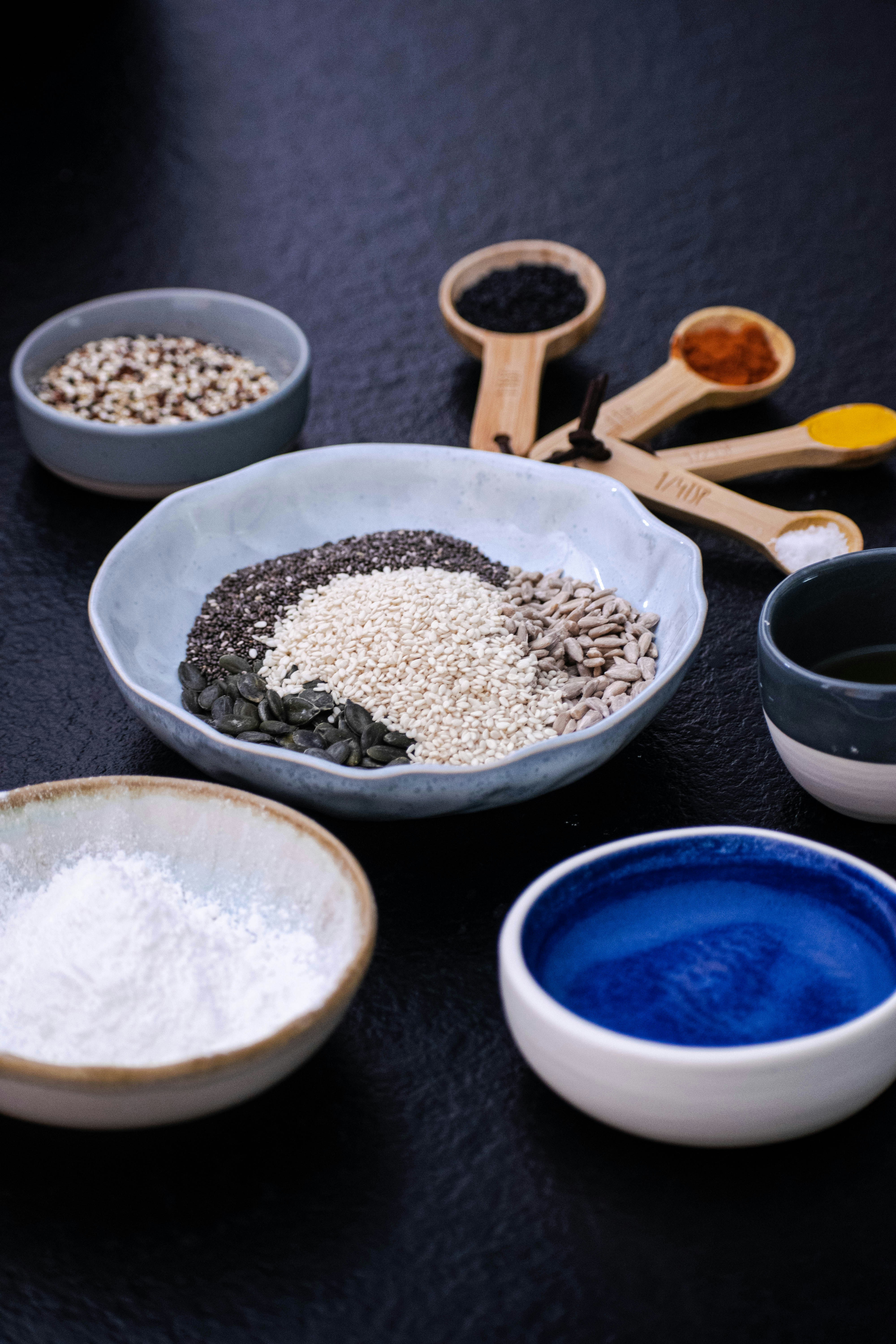 Seed Palette in a Ceramic Bowl: A Quiet Still Life of Grains and Powders