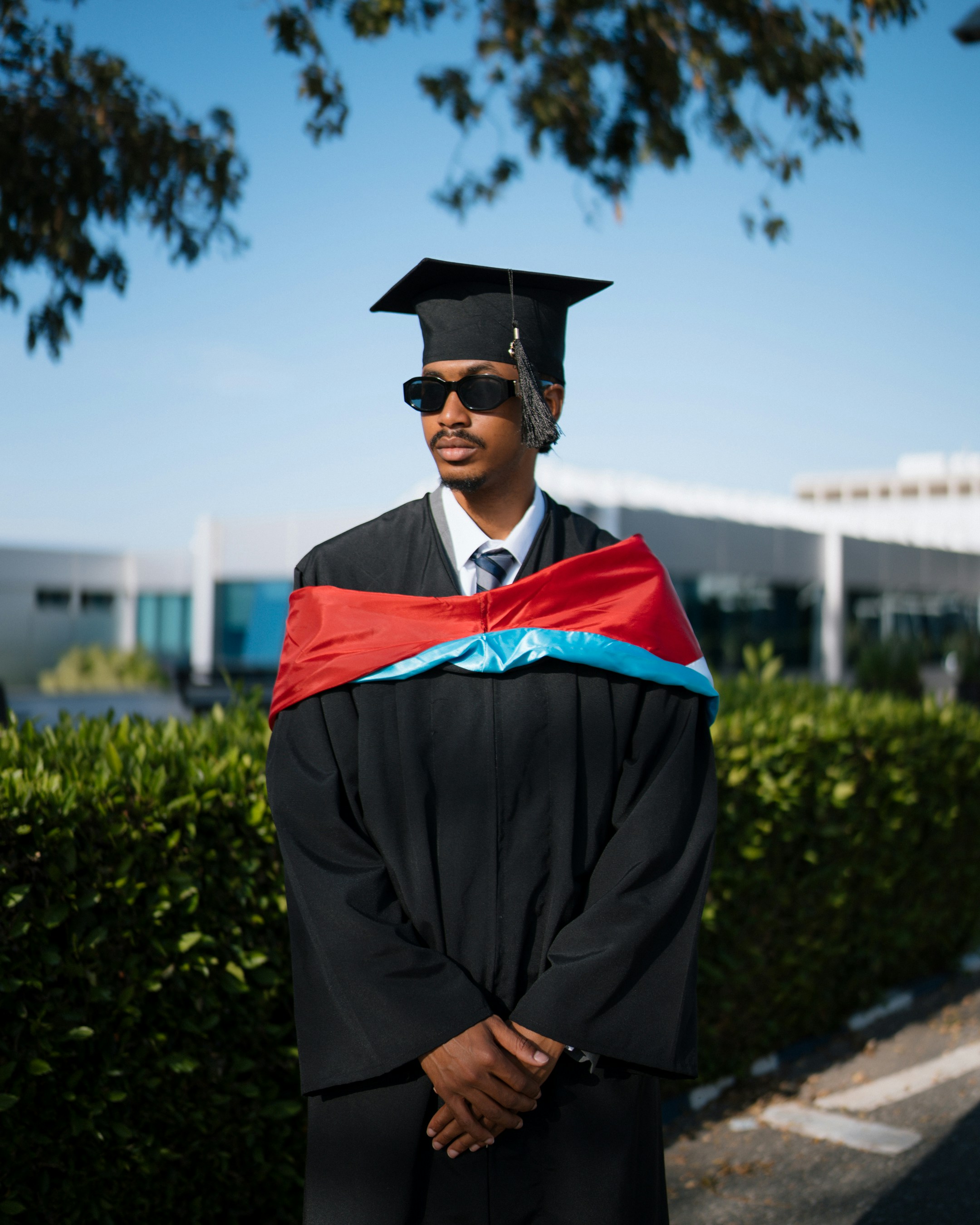 Ceremonial Stance: The Graduate in Center-Field Shadow