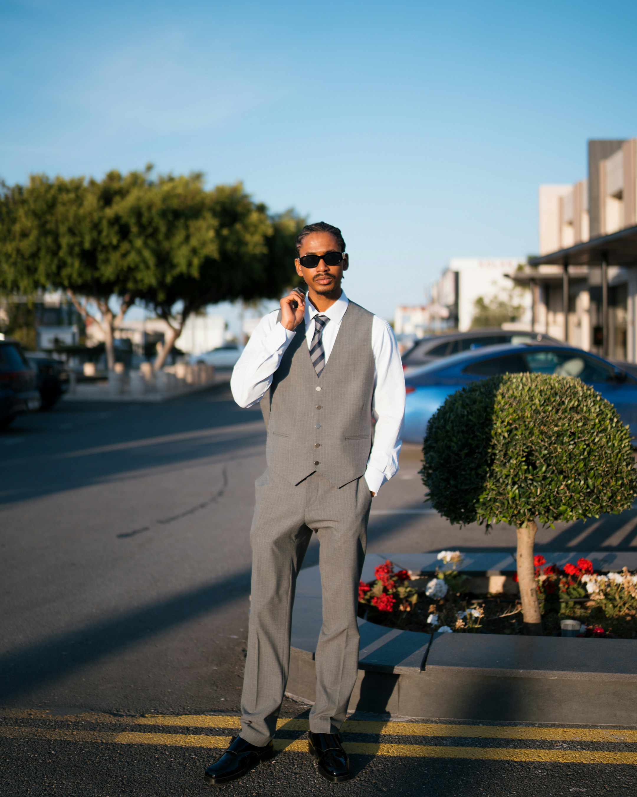 A Suited Stance in the Suburban Glow