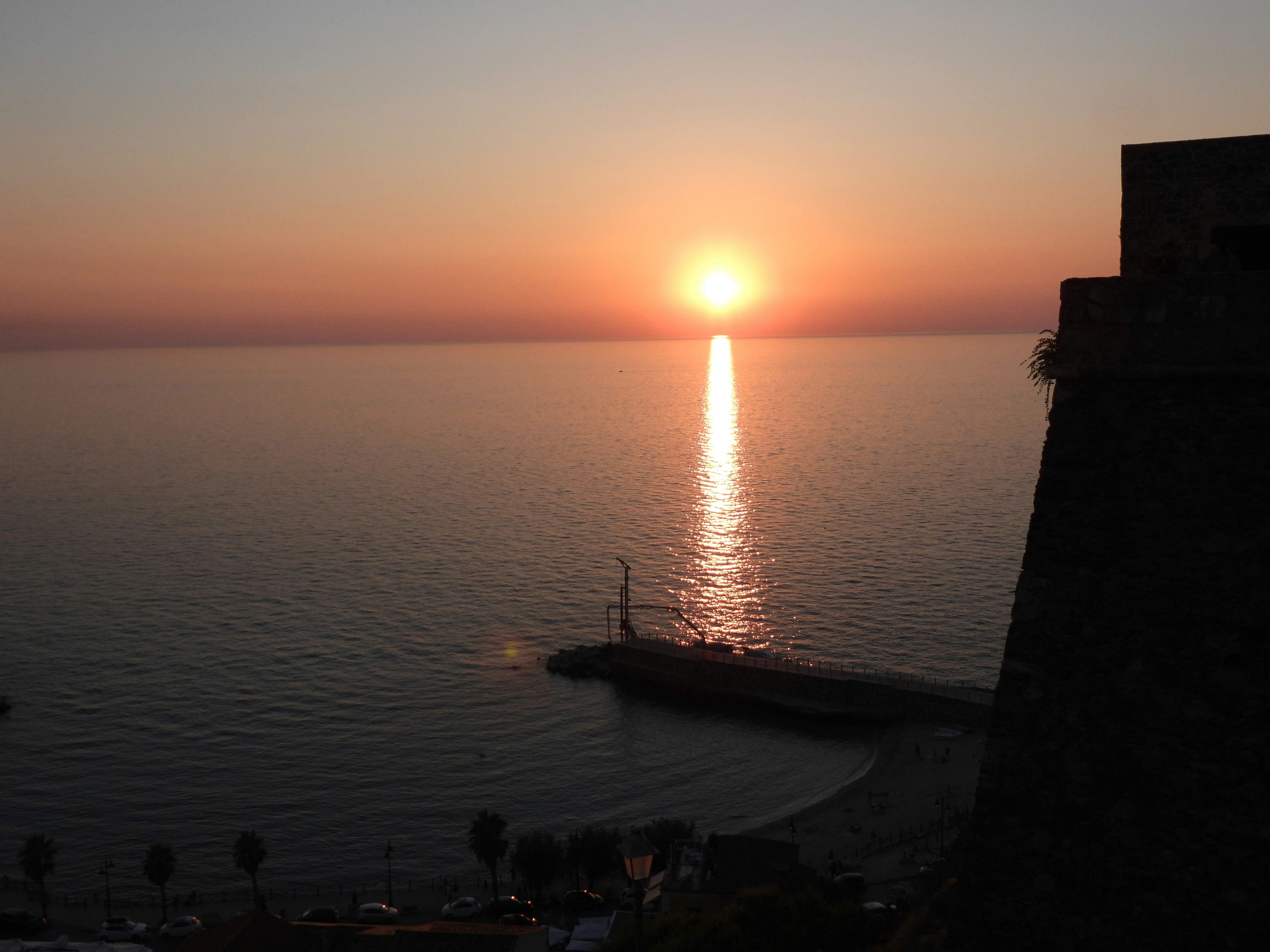 Sunlit Stillness Over the Harbor: Dusk at the Seaward Fortress