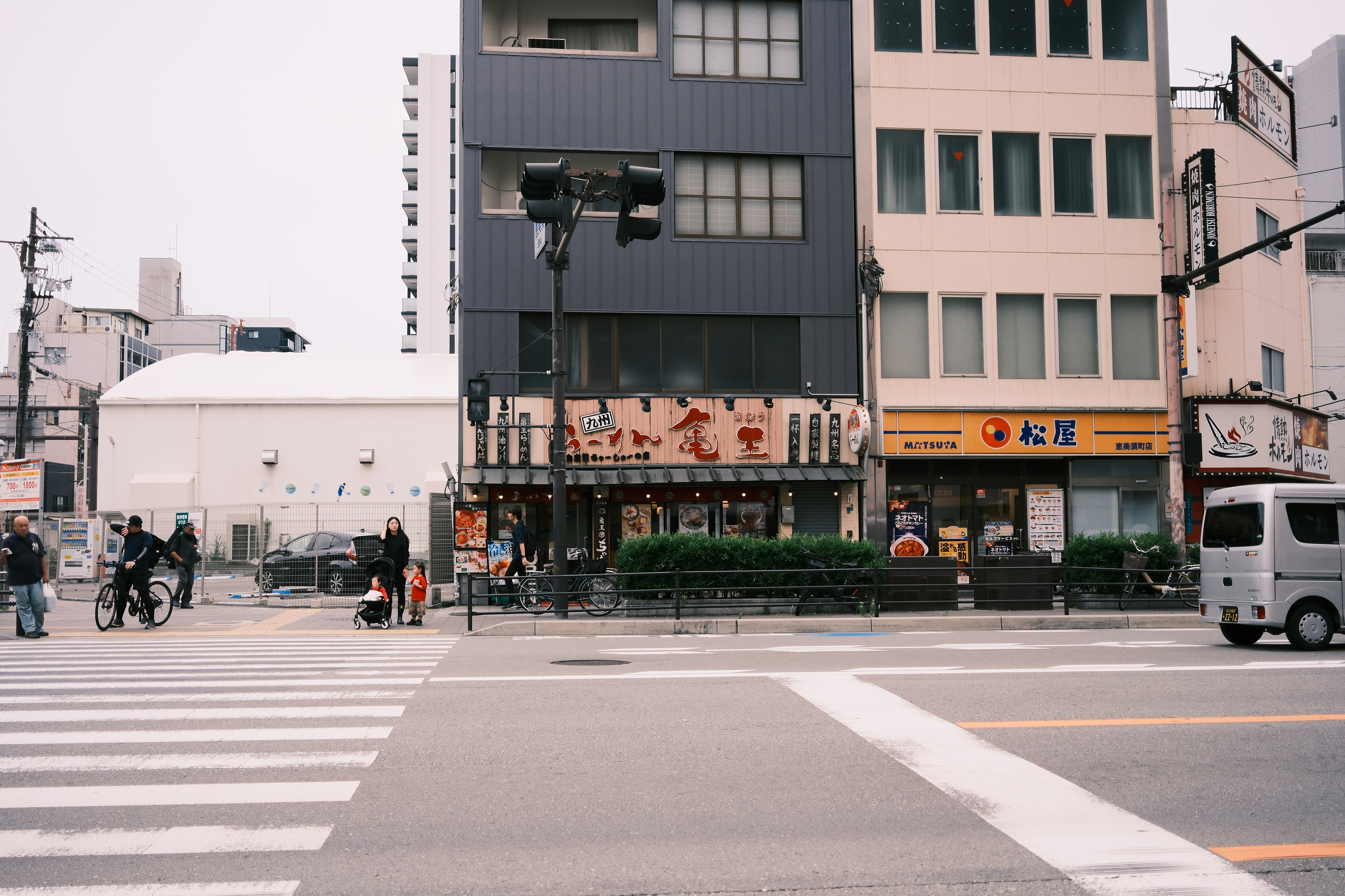 Urban Crossing: A Quiet Street Scene at Dawn