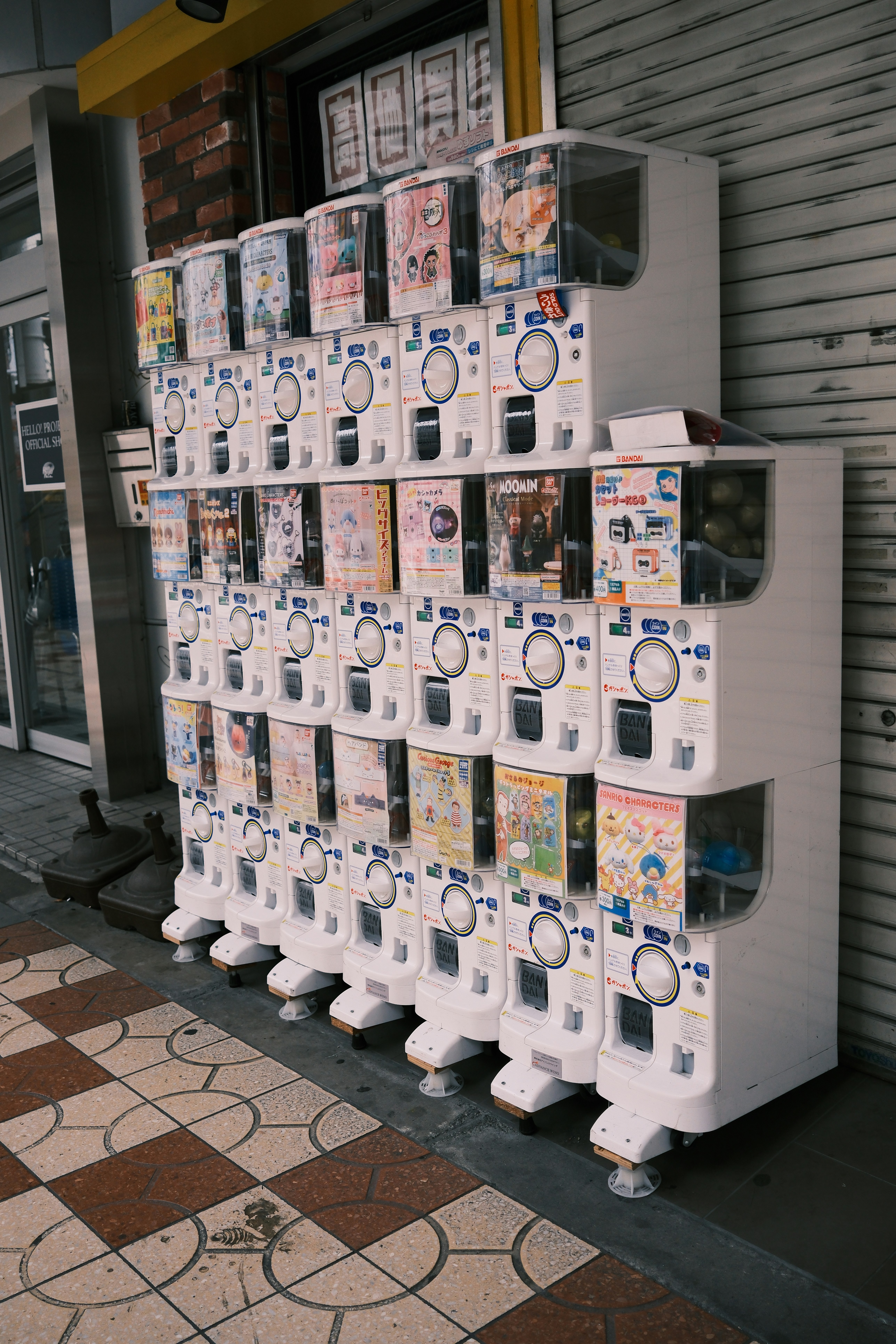 Row of Greeted Gacha: A Street Level Cascade of Capsule Vending Machines