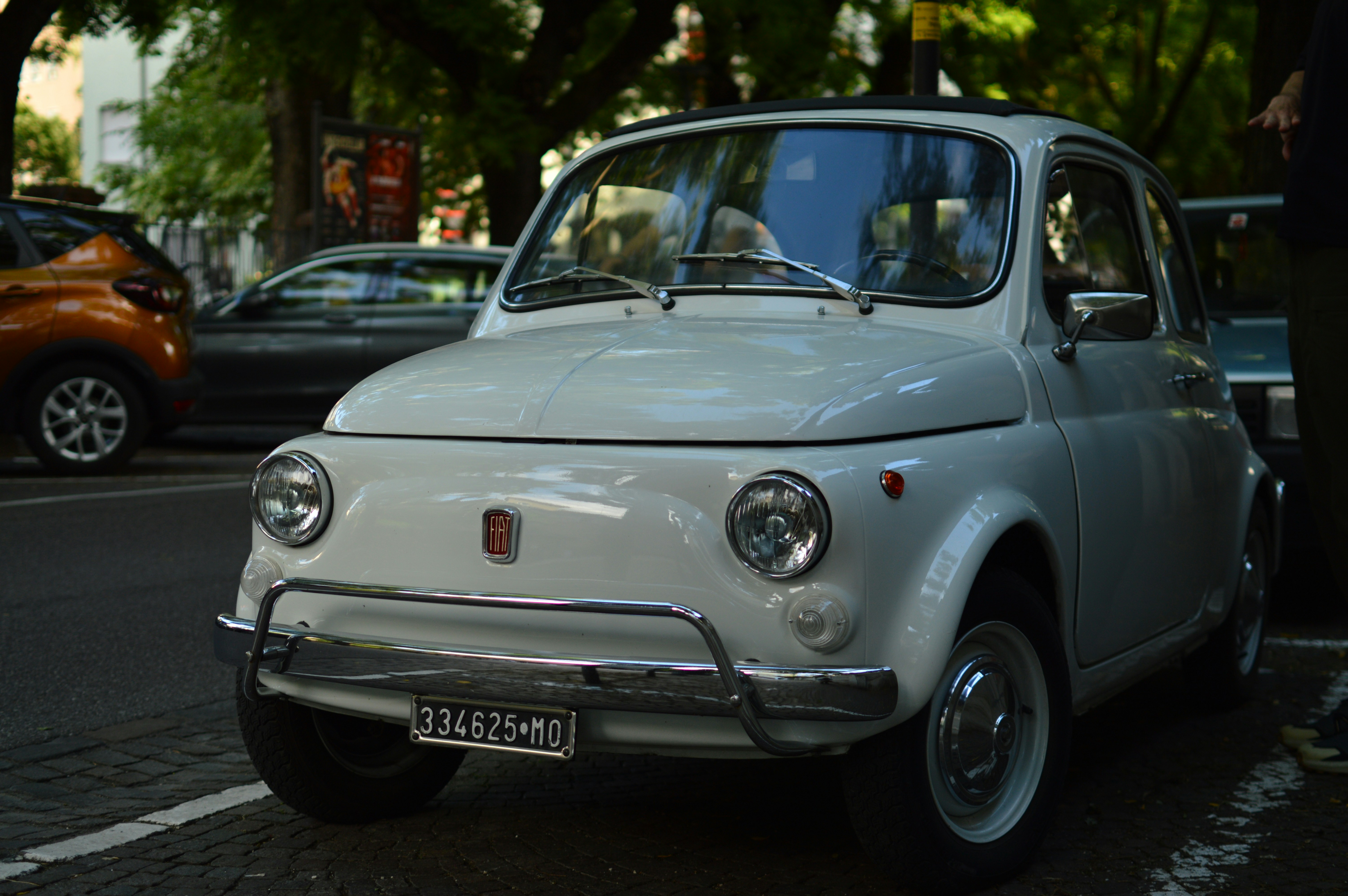 Quiet Retro: A Creamy Fiat 500 On City Cobblestones
