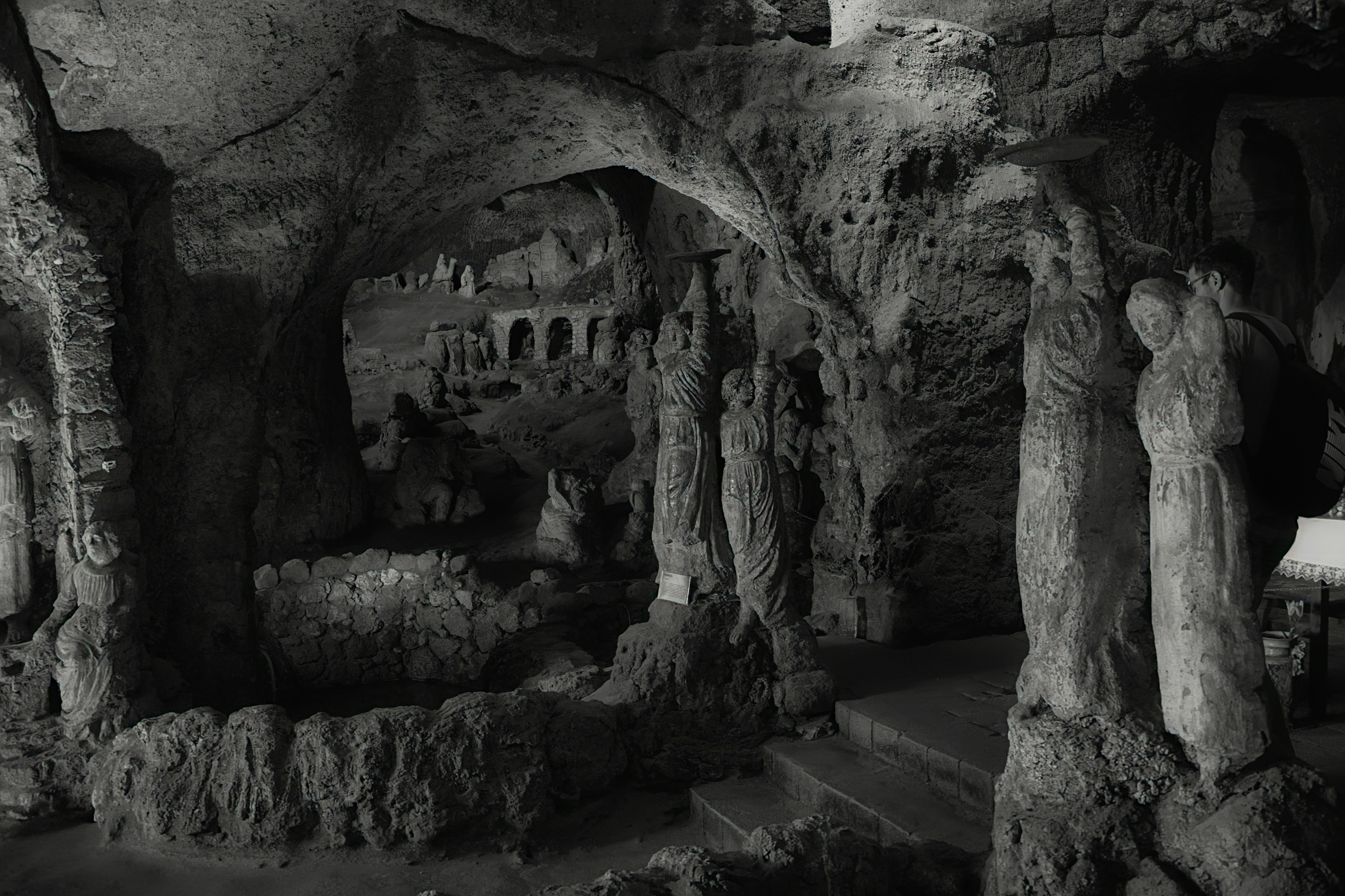 Stone Choir in Shadowed Cavern
